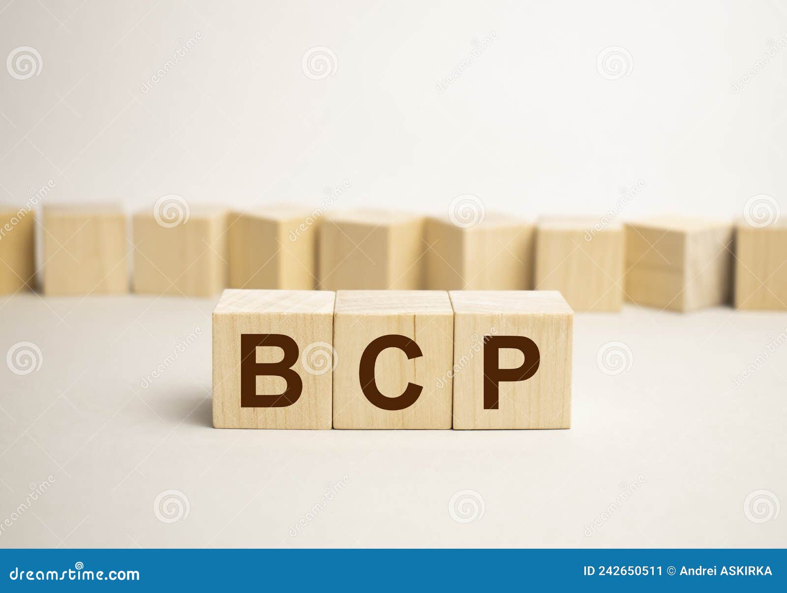 On a Bright Blue Background, Light Wooden Blocks and Cubes with the ...