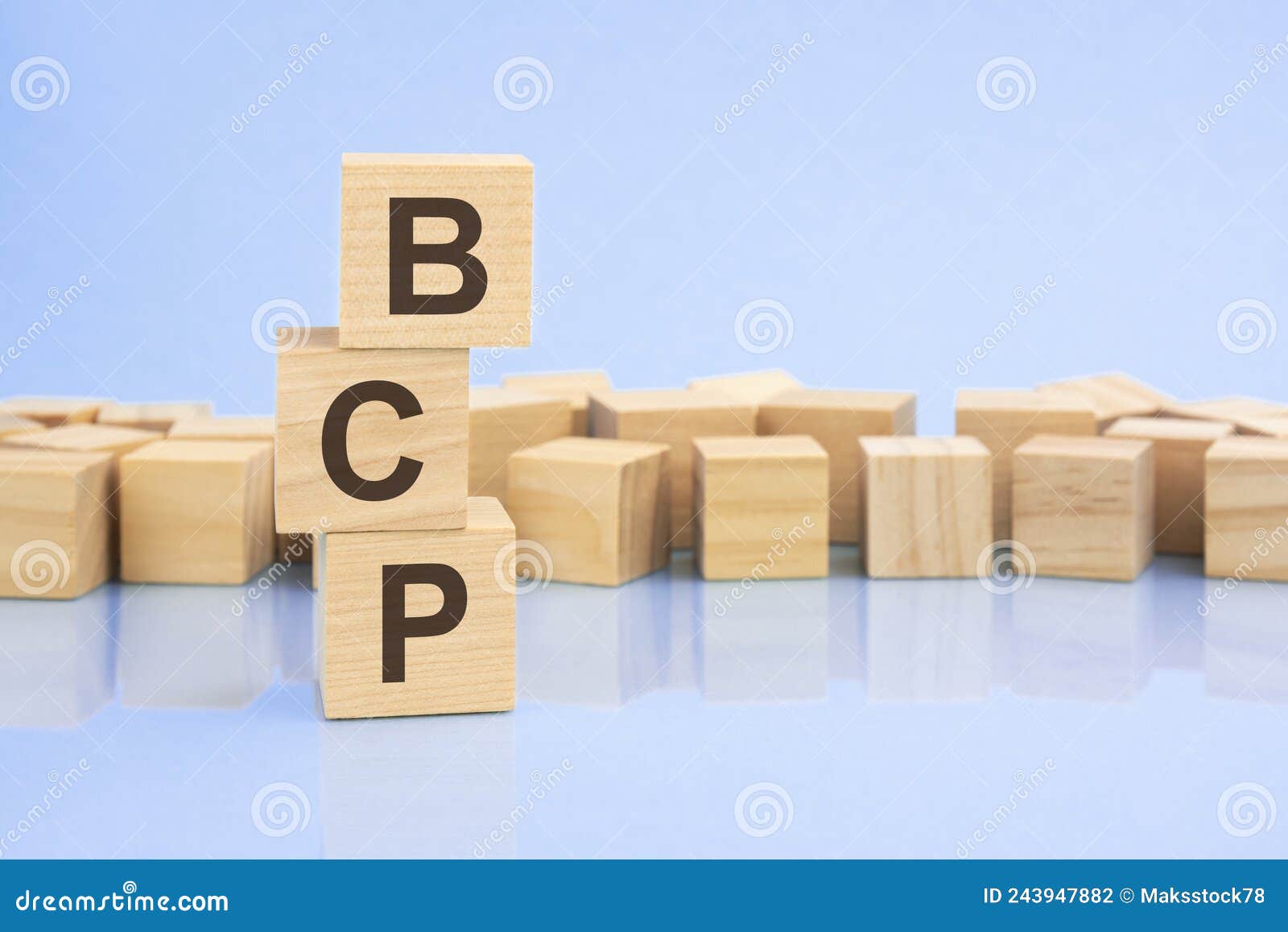 On a Bright Blue Background, Light Wooden Blocks and Cubes with the ...