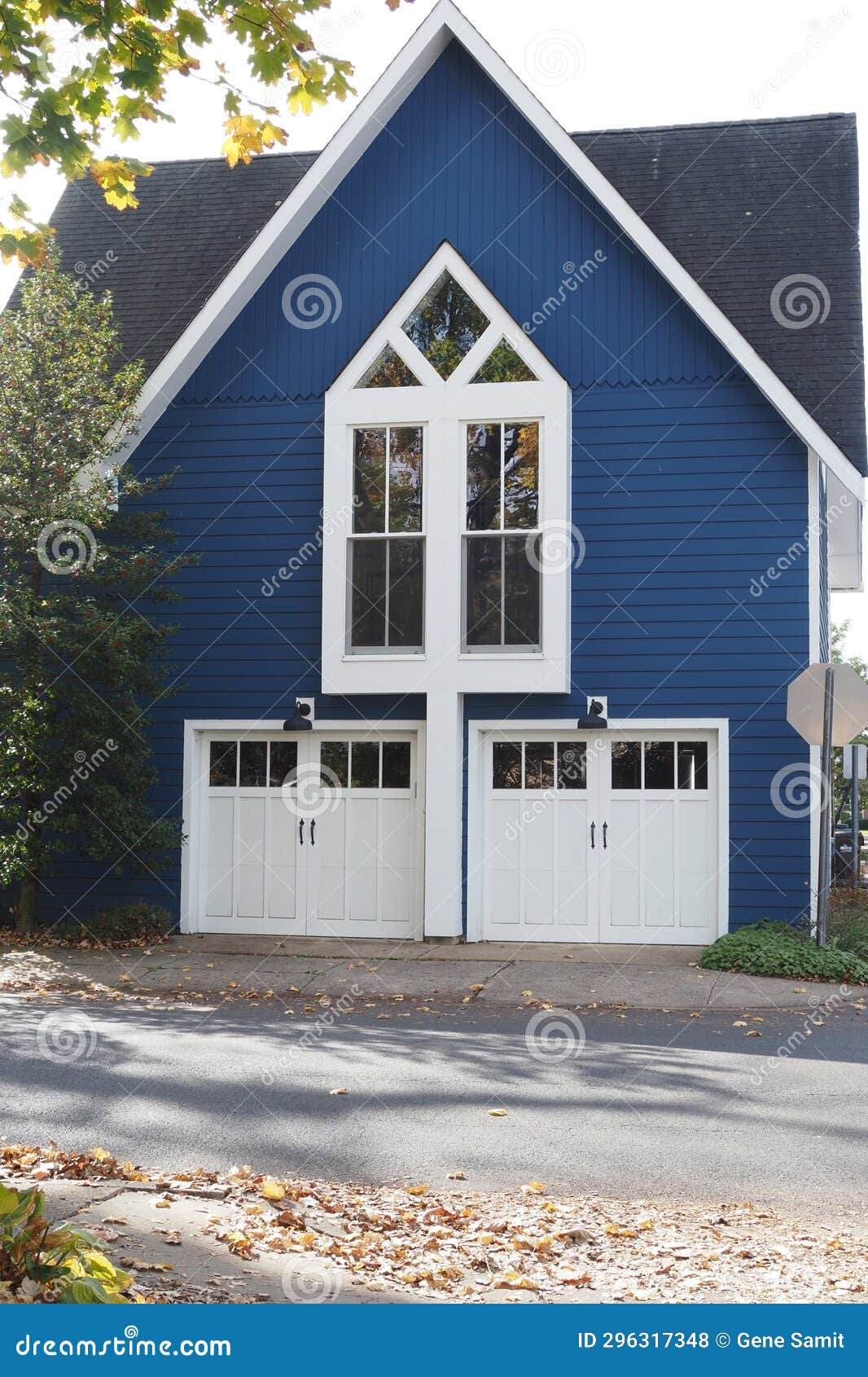 This Bright Blue Building Has a 2 Car Garage. Stock Photo - Image of ...