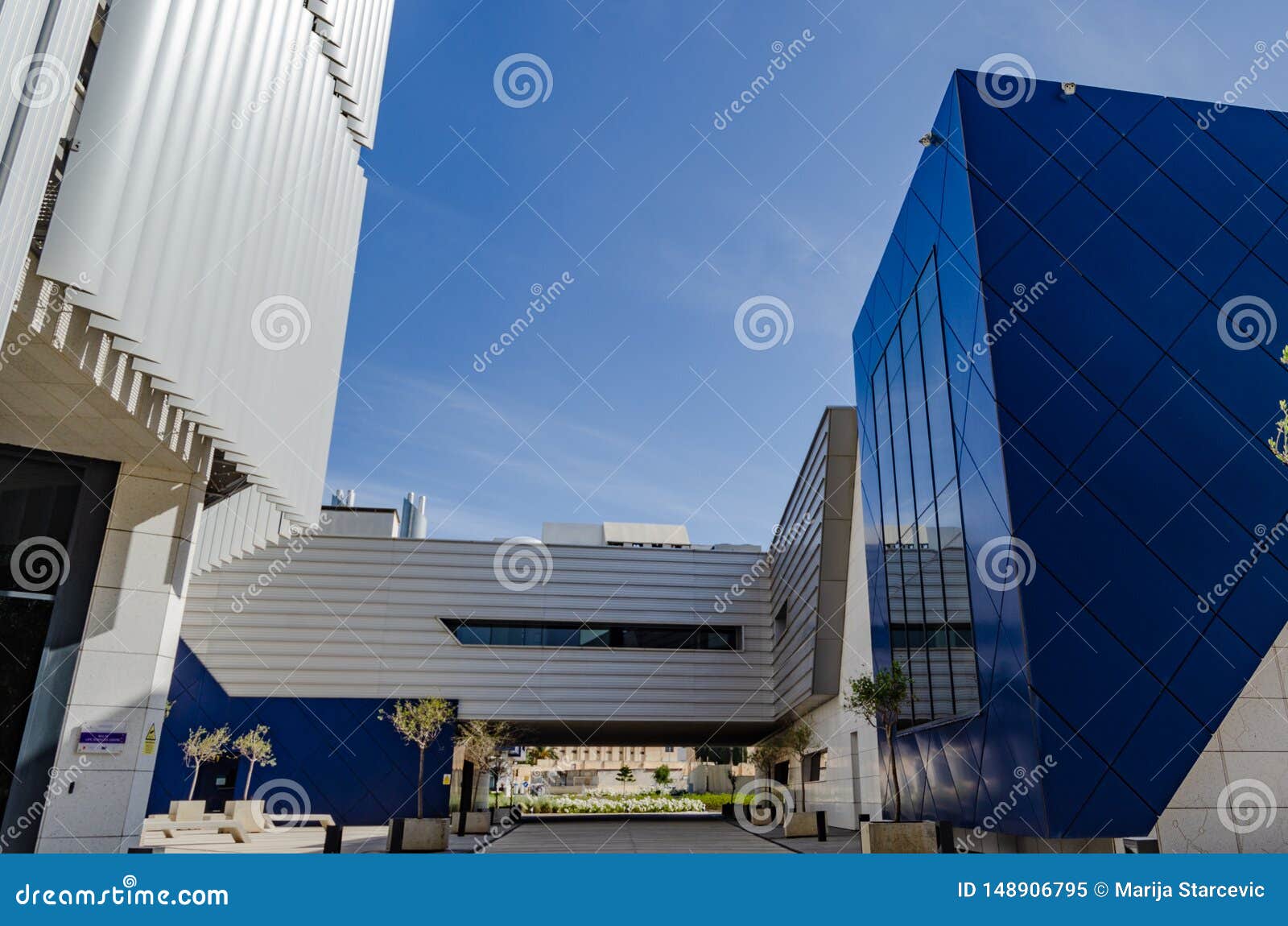 Bright Blue City Buildings with Clouds Stock Image - Image of cityscape ...