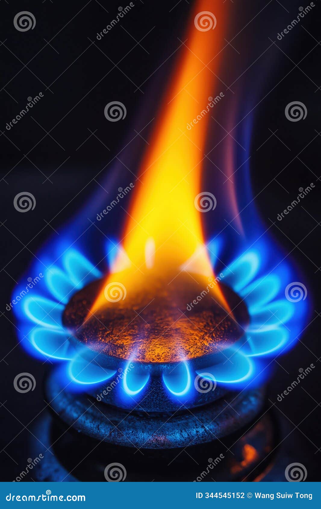 Bright Blue and Orange Flames Emerging from a Gas Burner in a Dark ...