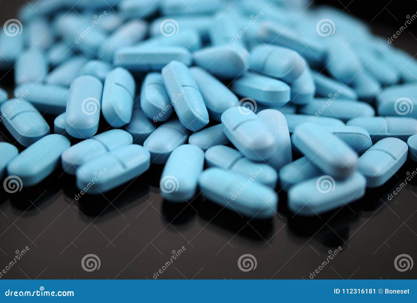 Bright blue oval tablets stock image. Image of natural - 112316181