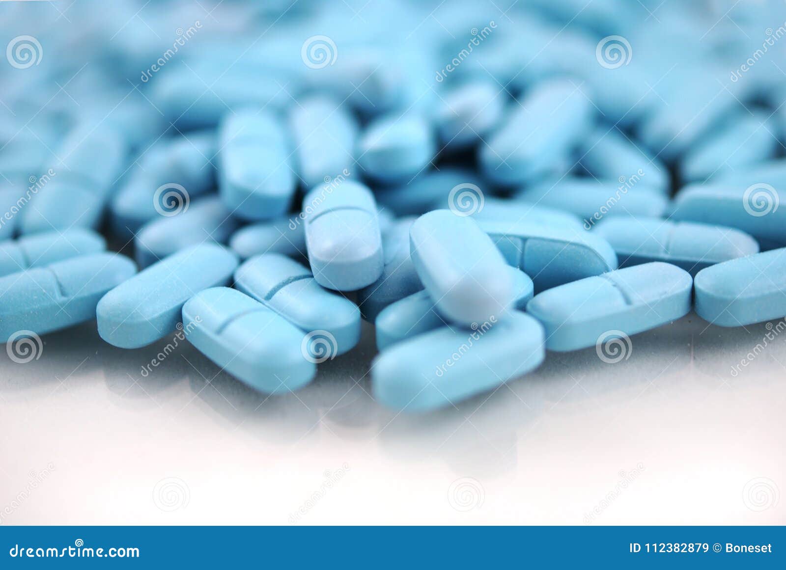 Bright blue oval tablets stock image. Image of blue - 112382879