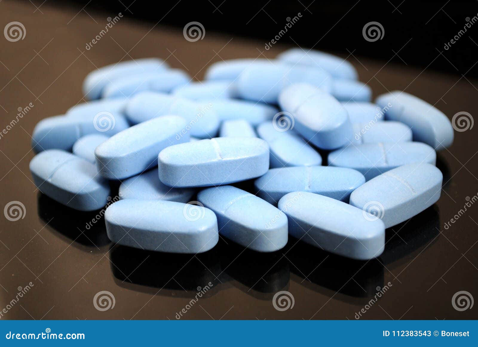 Bright blue oval tablets stock image. Image of oval - 112383543
