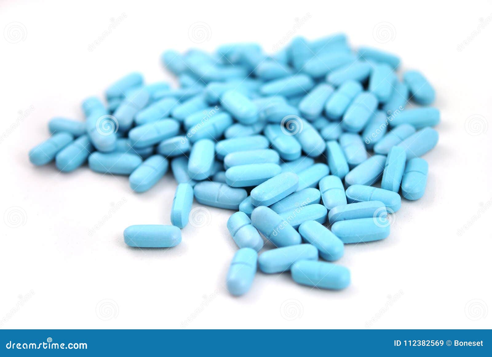 Bright blue oval tablets stock image. Image of medicament - 112382569