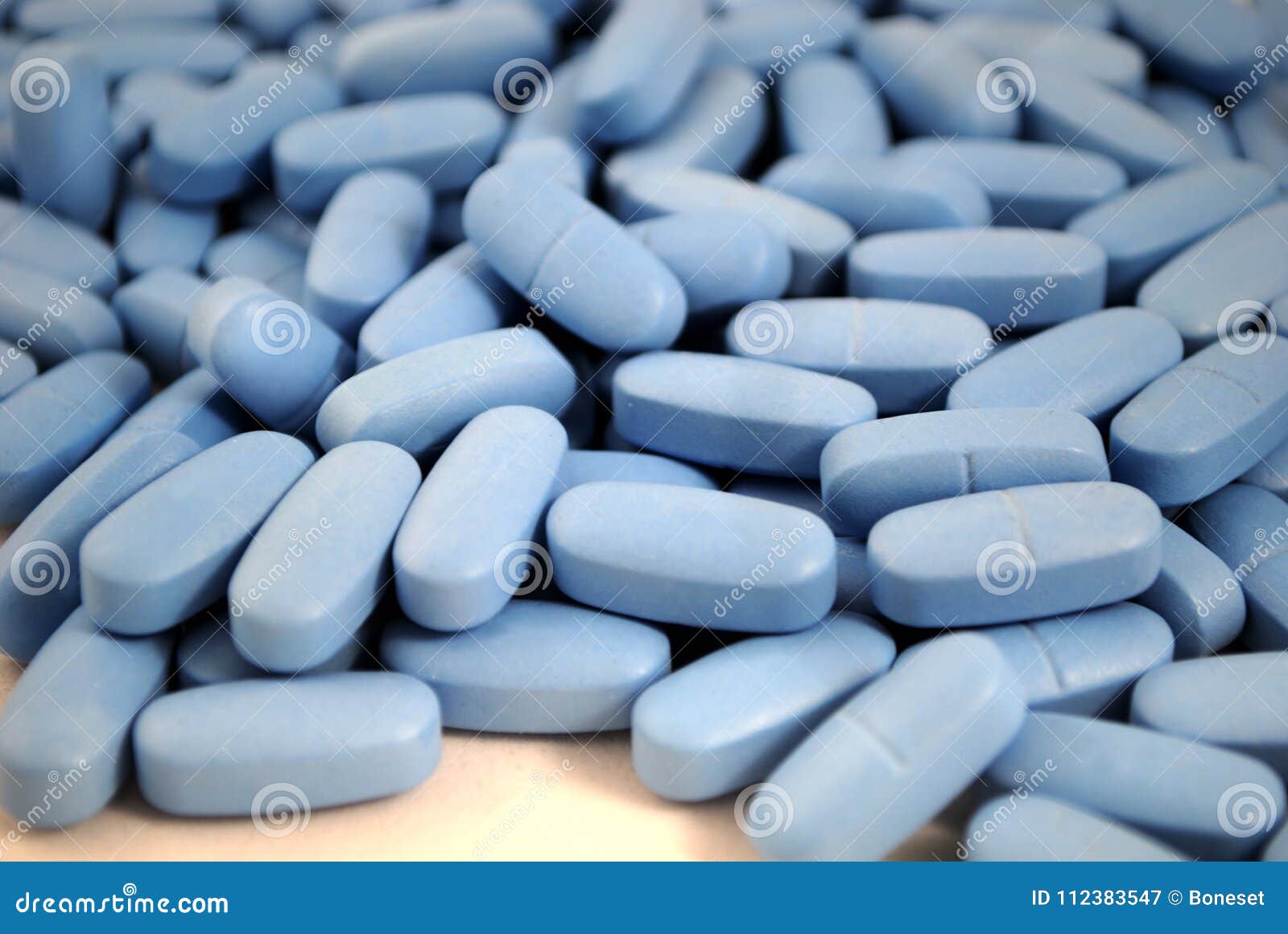 Bright blue oval tablets stock image. Image of natural - 112383547
