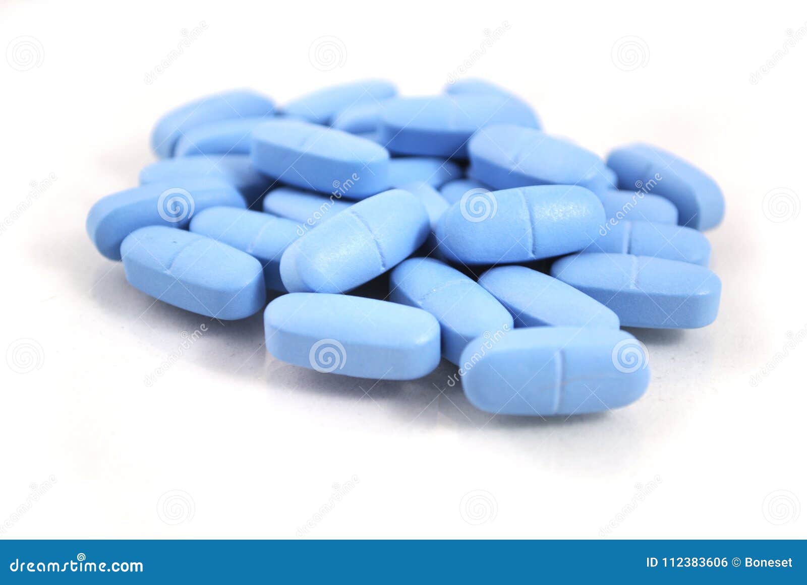 Bright blue oval tablets stock photo. Image of healthcare - 112383606
