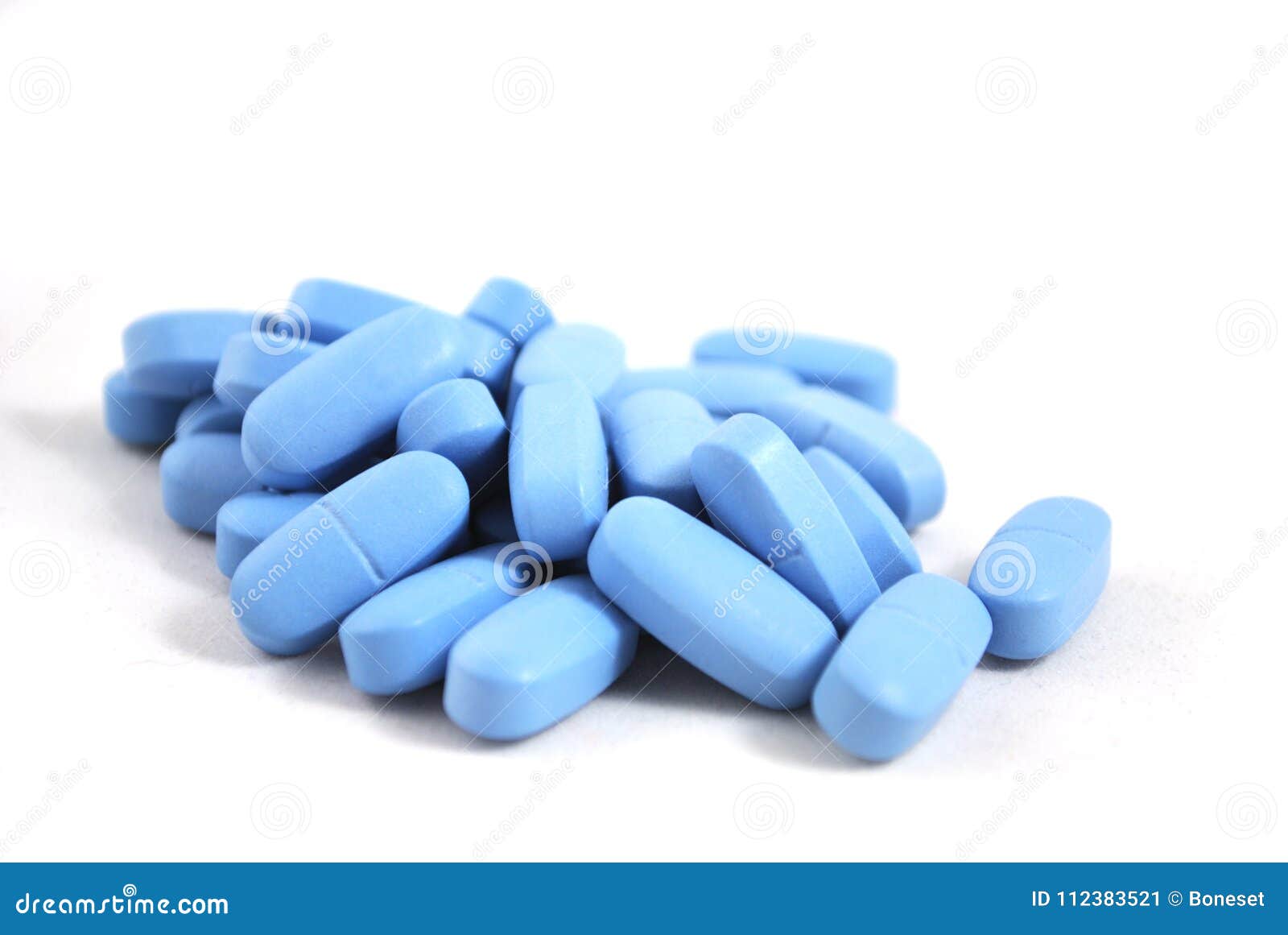 Bright blue oval tablets stock image. Image of medicine - 112383521