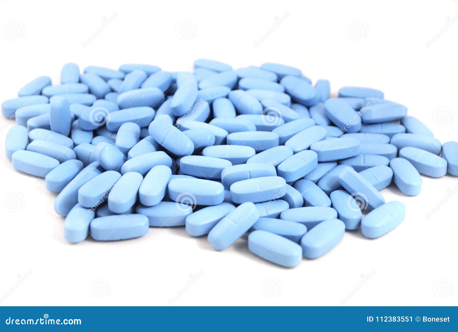 Bright blue oval tablets stock image. Image of background - 112383551