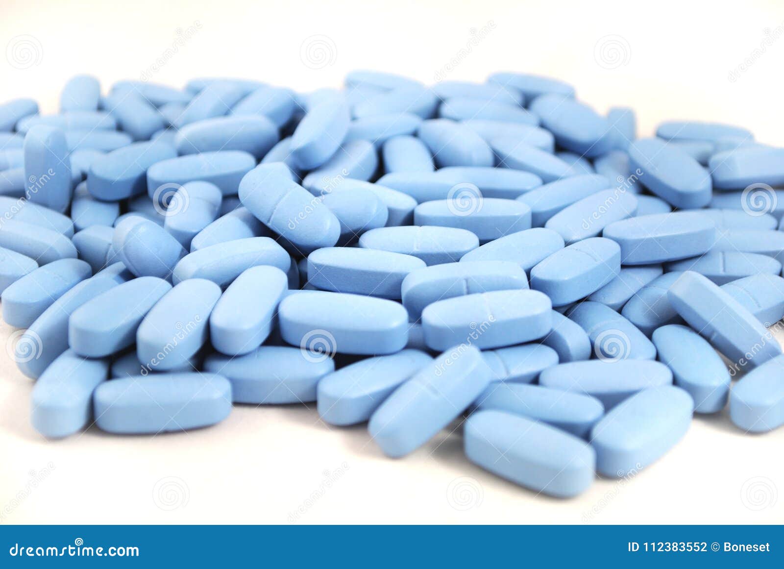 Bright blue oval tablets stock photo. Image of oval - 112383552
