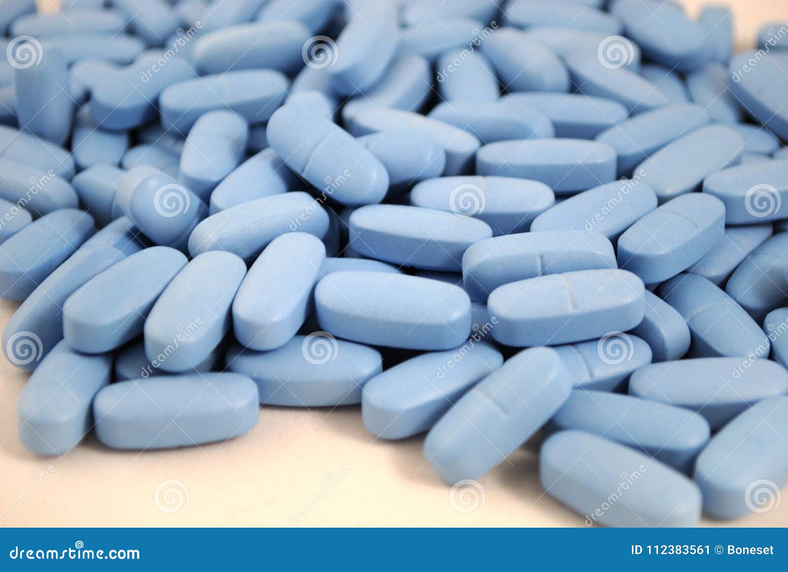 Bright blue oval tablets stock image. Image of medicine - 112383561