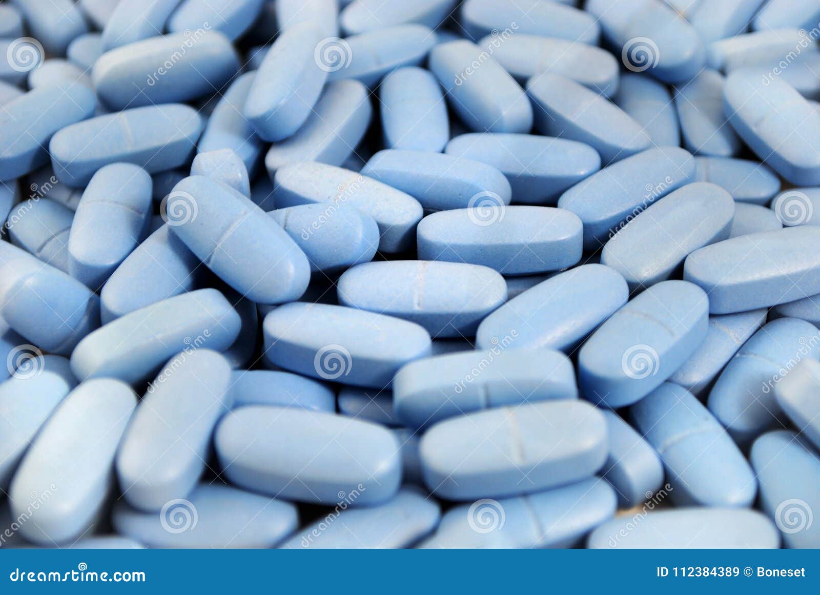 Bright blue oval tablets stock image. Image of drug - 112384389