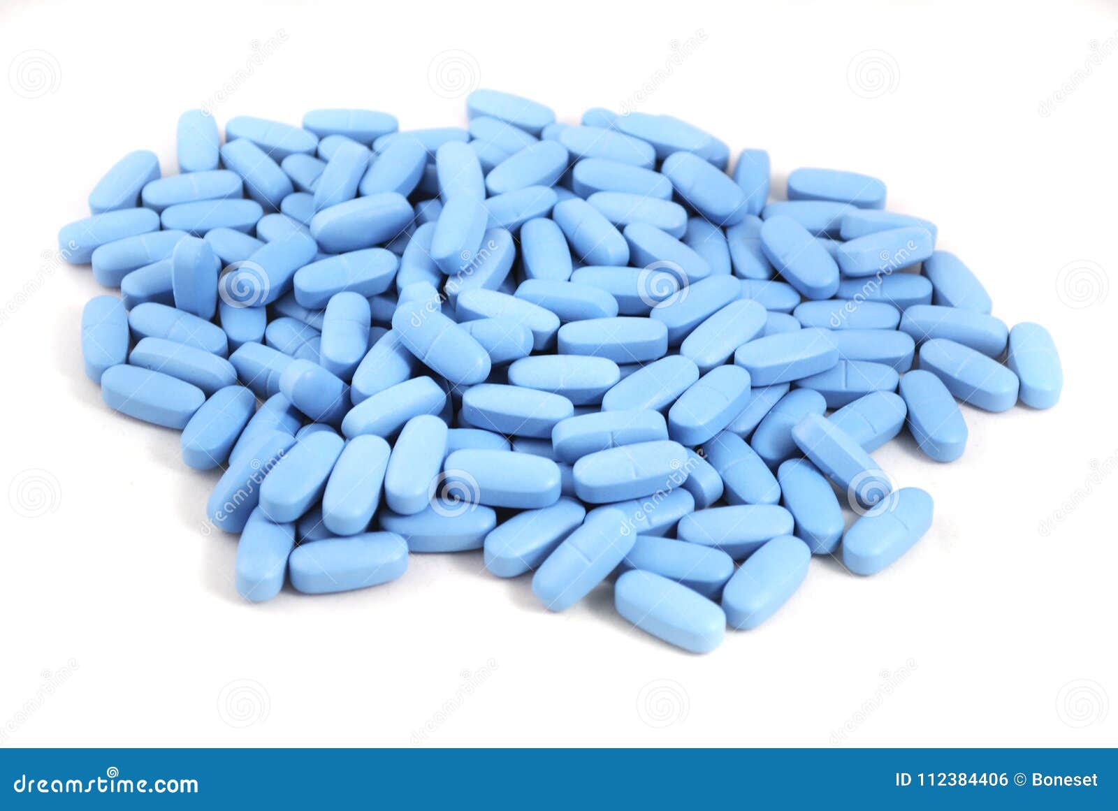 Bright blue oval tablets stock photo. Image of medication - 112384406