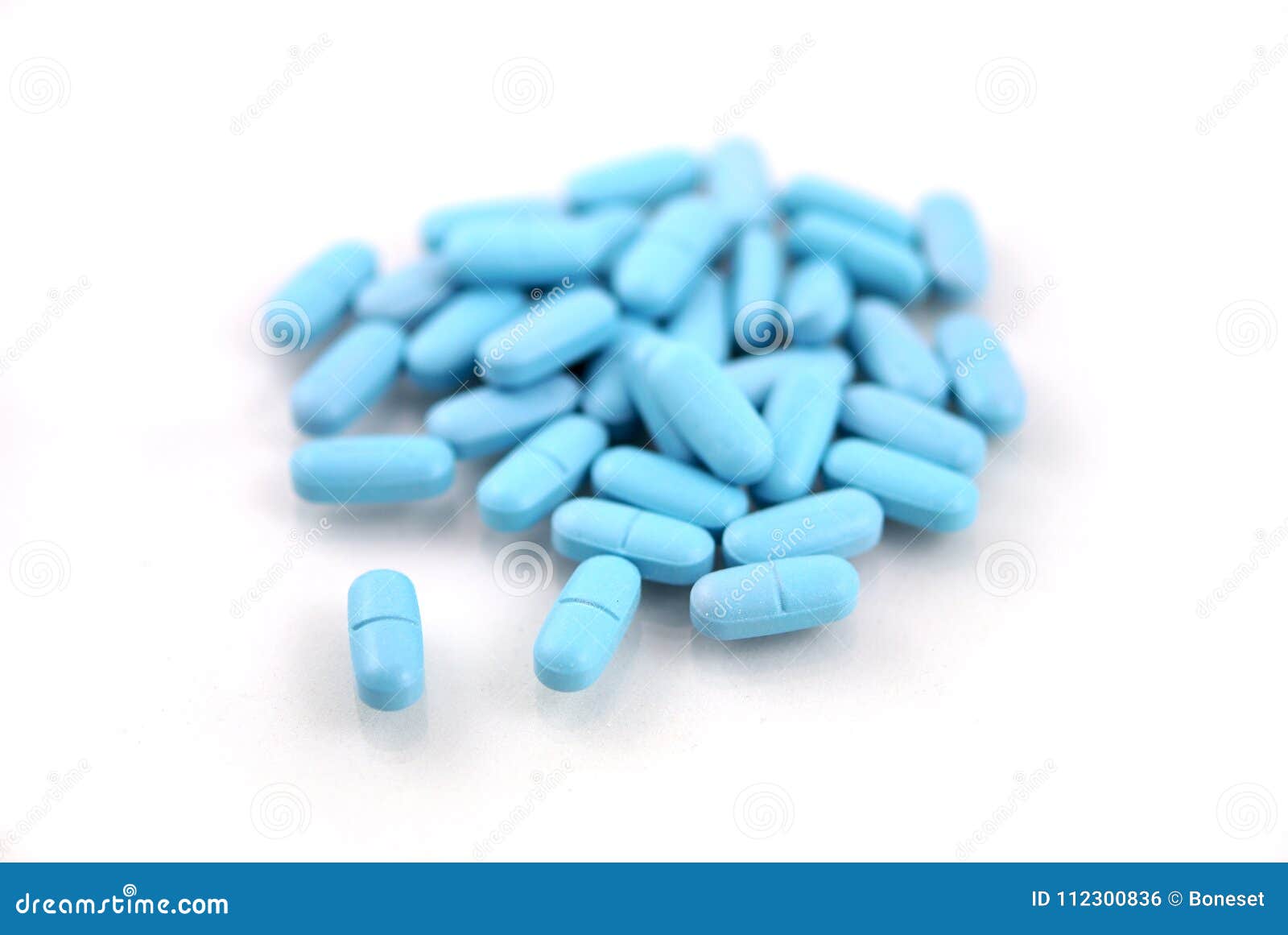 Bright Blue Oval Tablets Isolated Stock Photo - Image of closeup ...