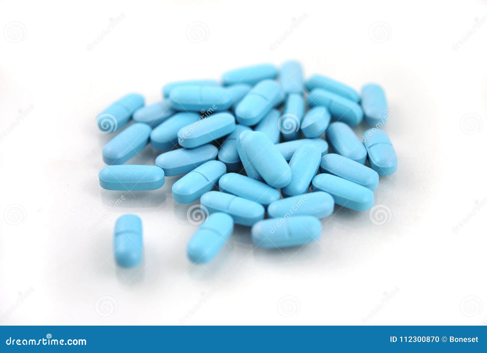 Bright Blue Oval Tablets Isolated Stock Photo - Image of isolated ...