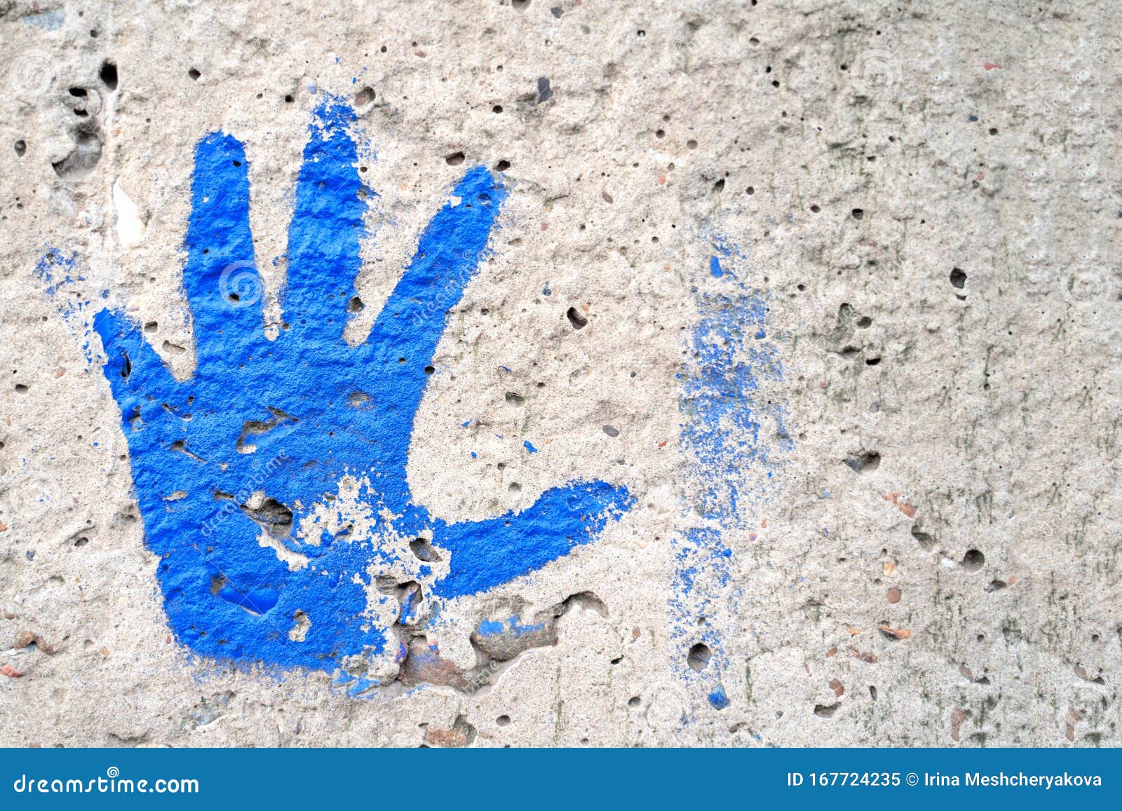 Bright Blue Palm Print with Paint Spots on the External Wall Surface ...