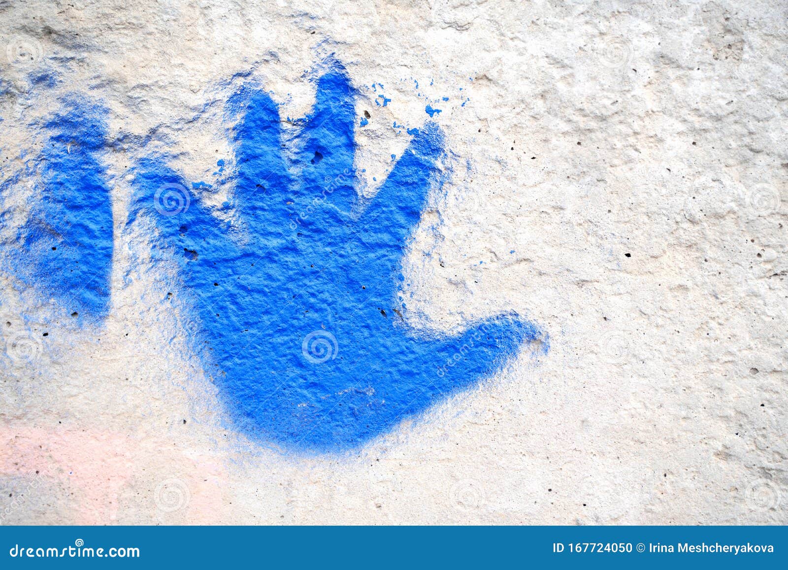 Bright Blue Palm Print with Paint Spots on the External Wall Surface ...