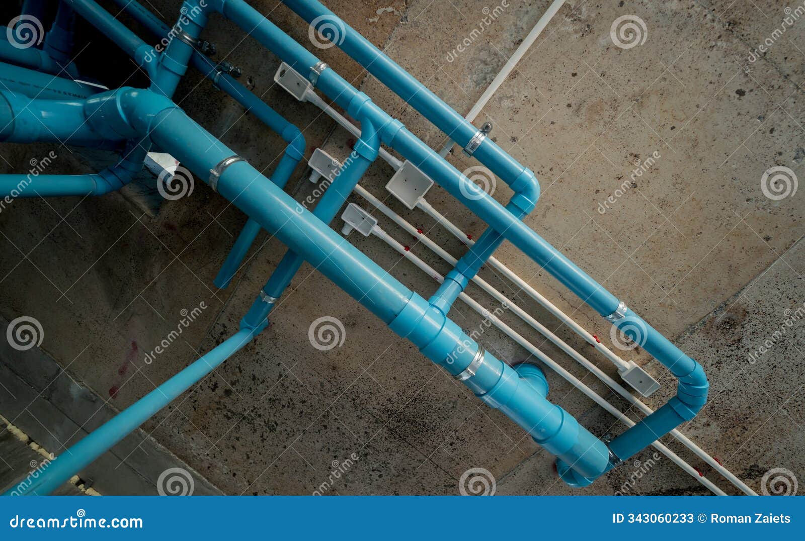 A Bright Blue Pipes Attached To a Solid Concrete Wall Stock Image ...