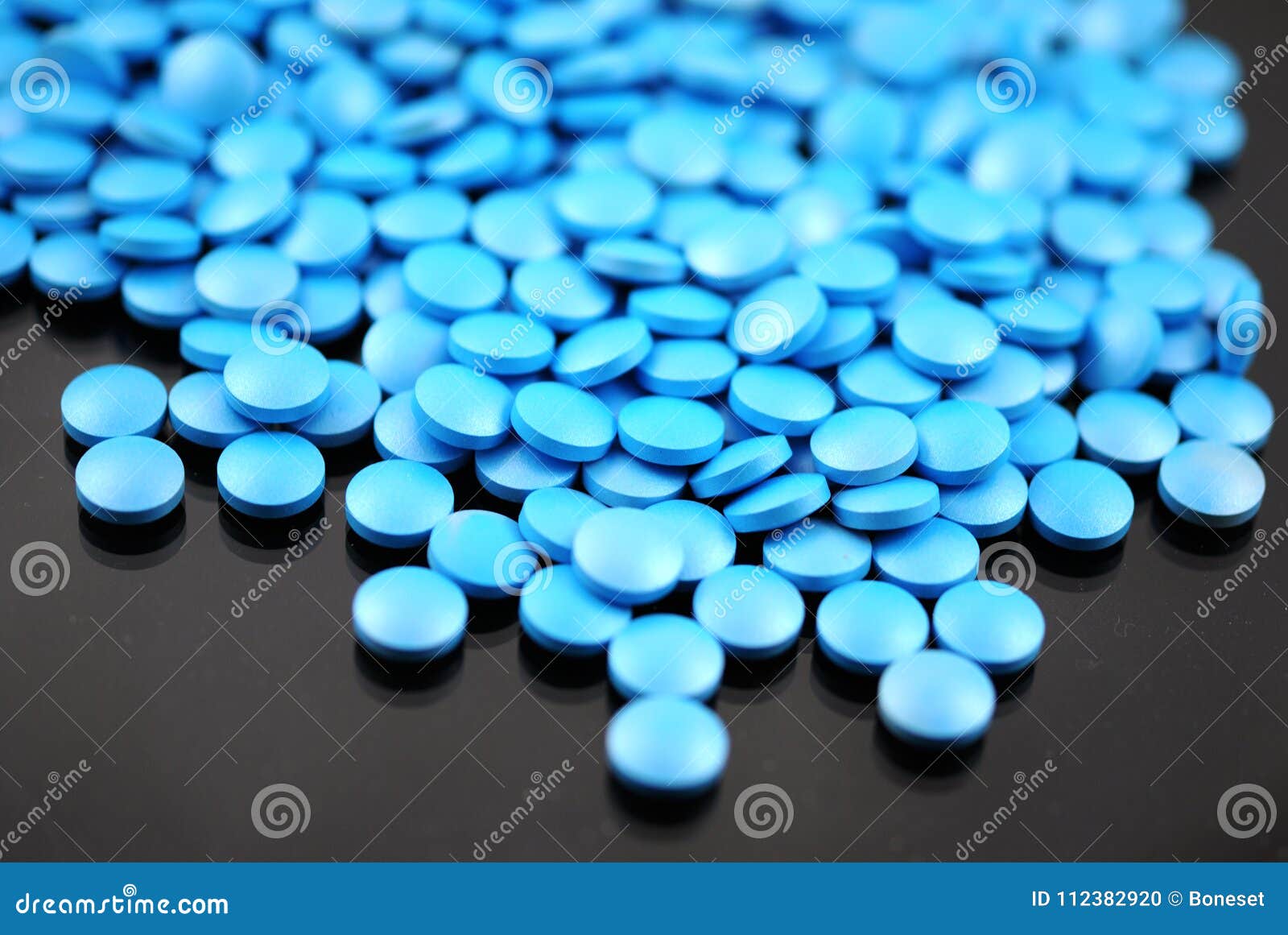 Bright blue round tablets stock photo. Image of antibiotic - 112382920