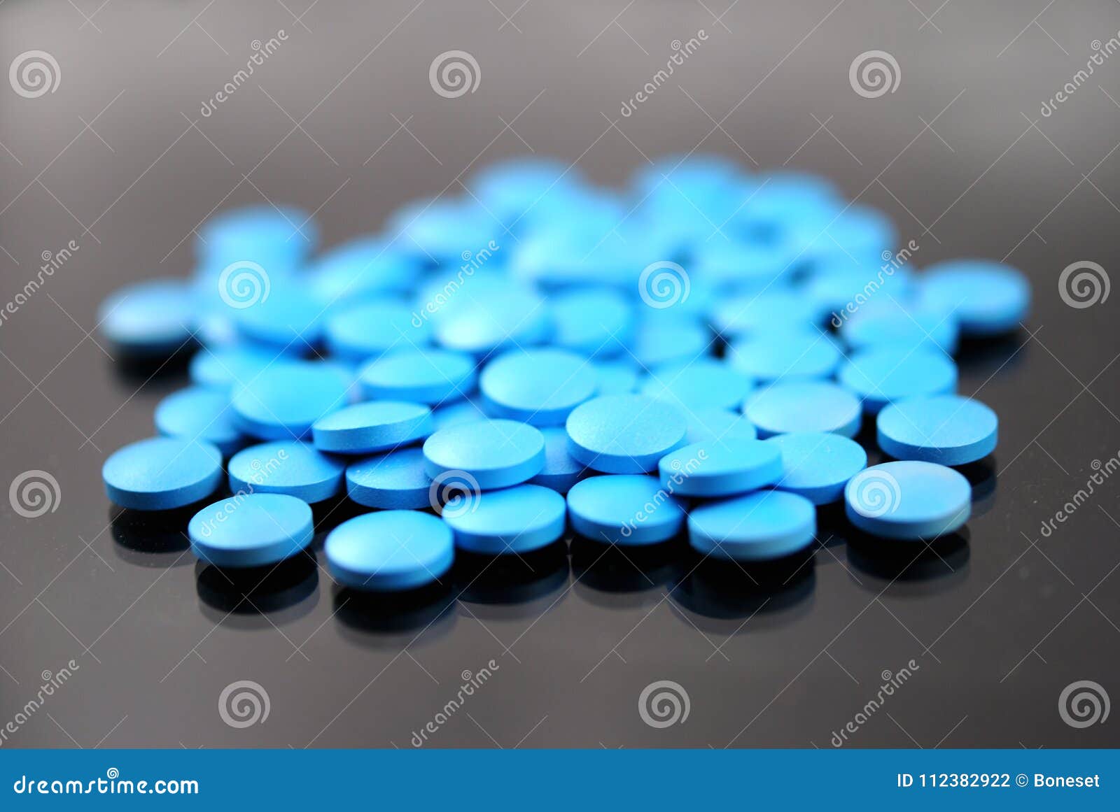 Bright blue round tablets stock photo. Image of medical - 112382922