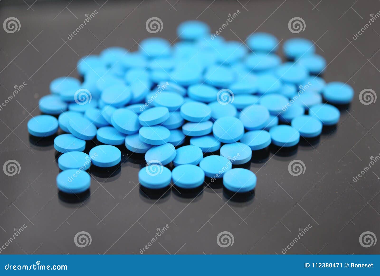 Bright blue round tablets stock image. Image of healthy - 112380471