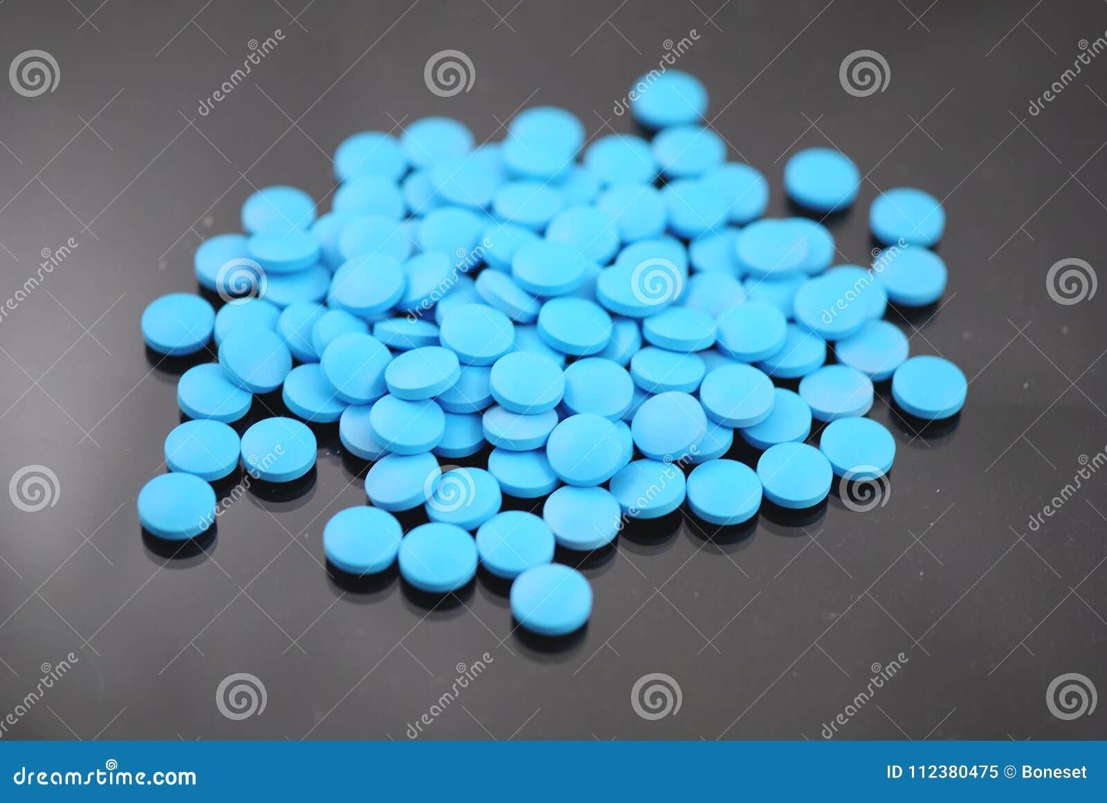 Bright blue round tablets stock image. Image of care - 112380475
