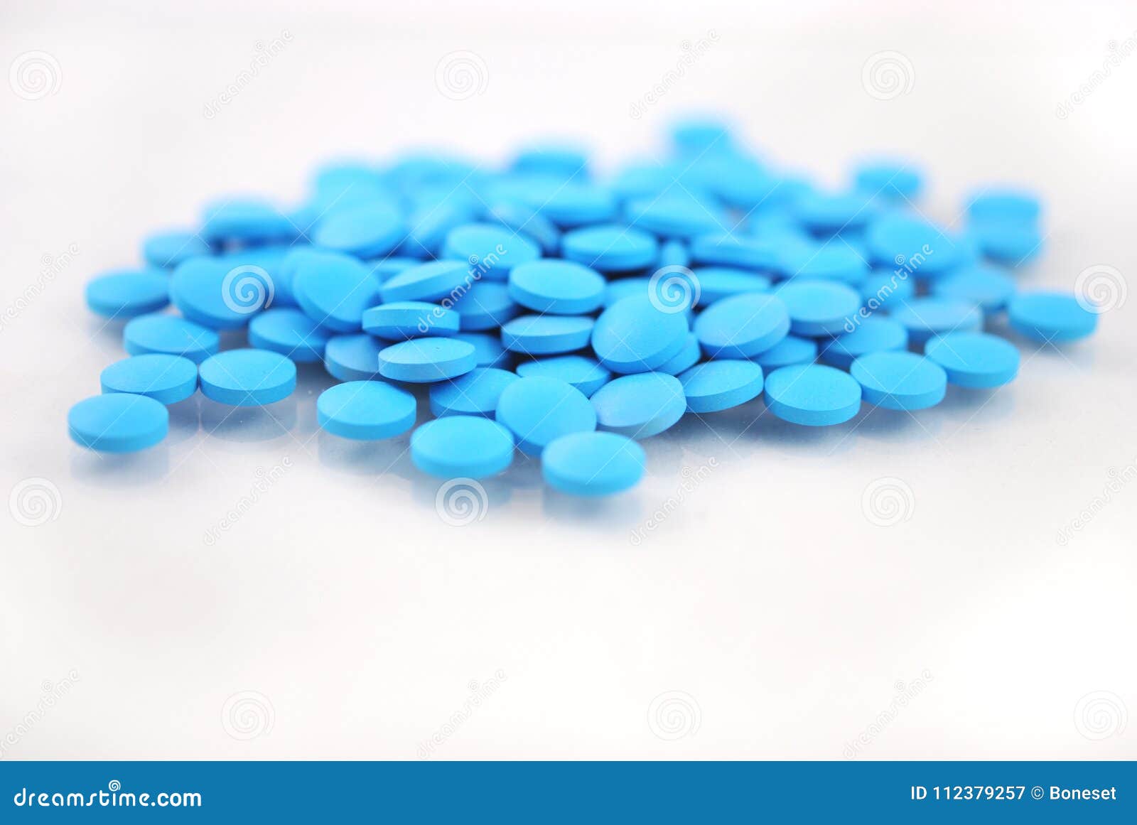Bright blue round tablets stock image. Image of natural - 112379257