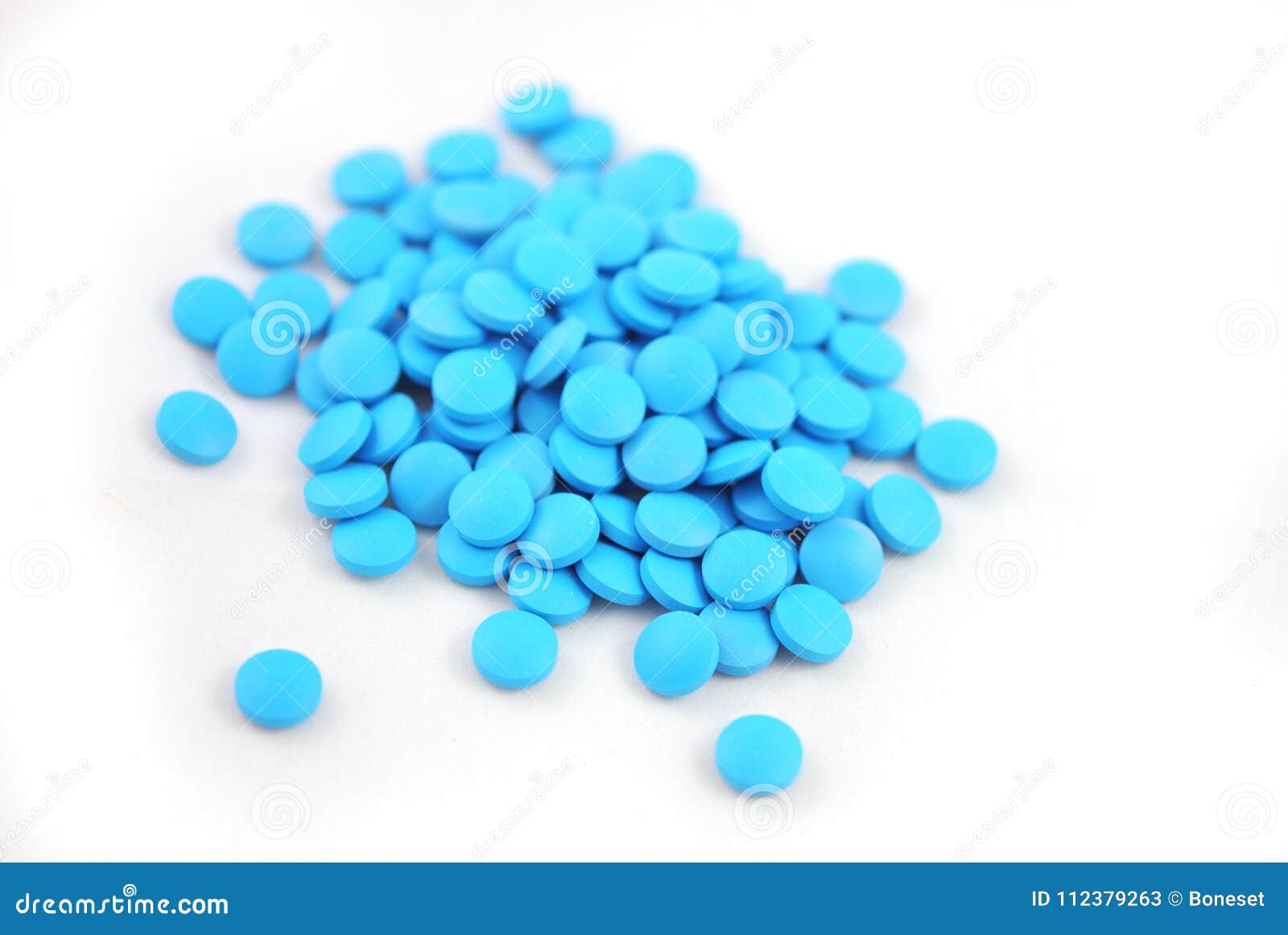 Bright blue round tablets stock image. Image of natural - 112379263