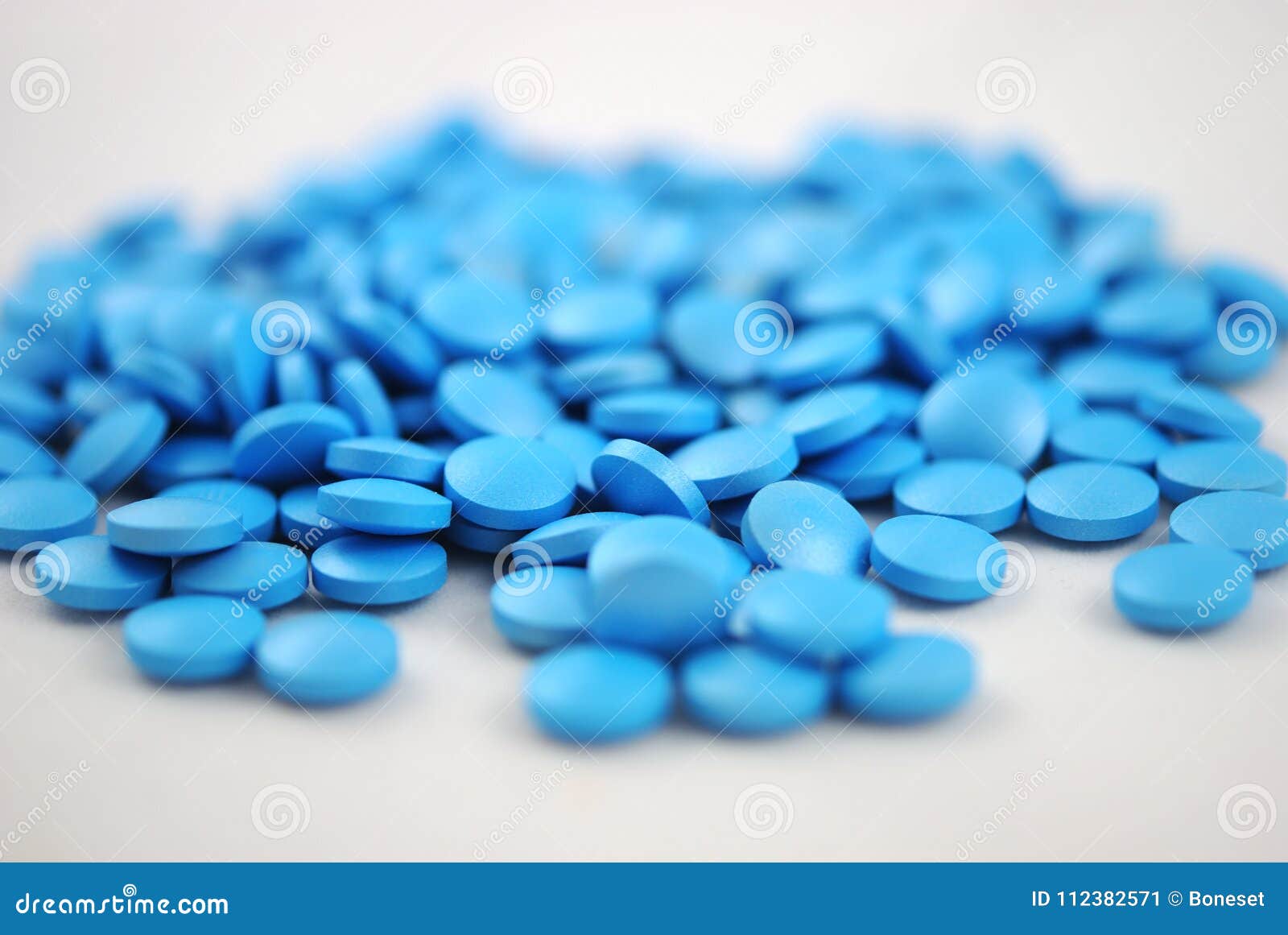 Bright blue round tablets stock image. Image of care - 112382571