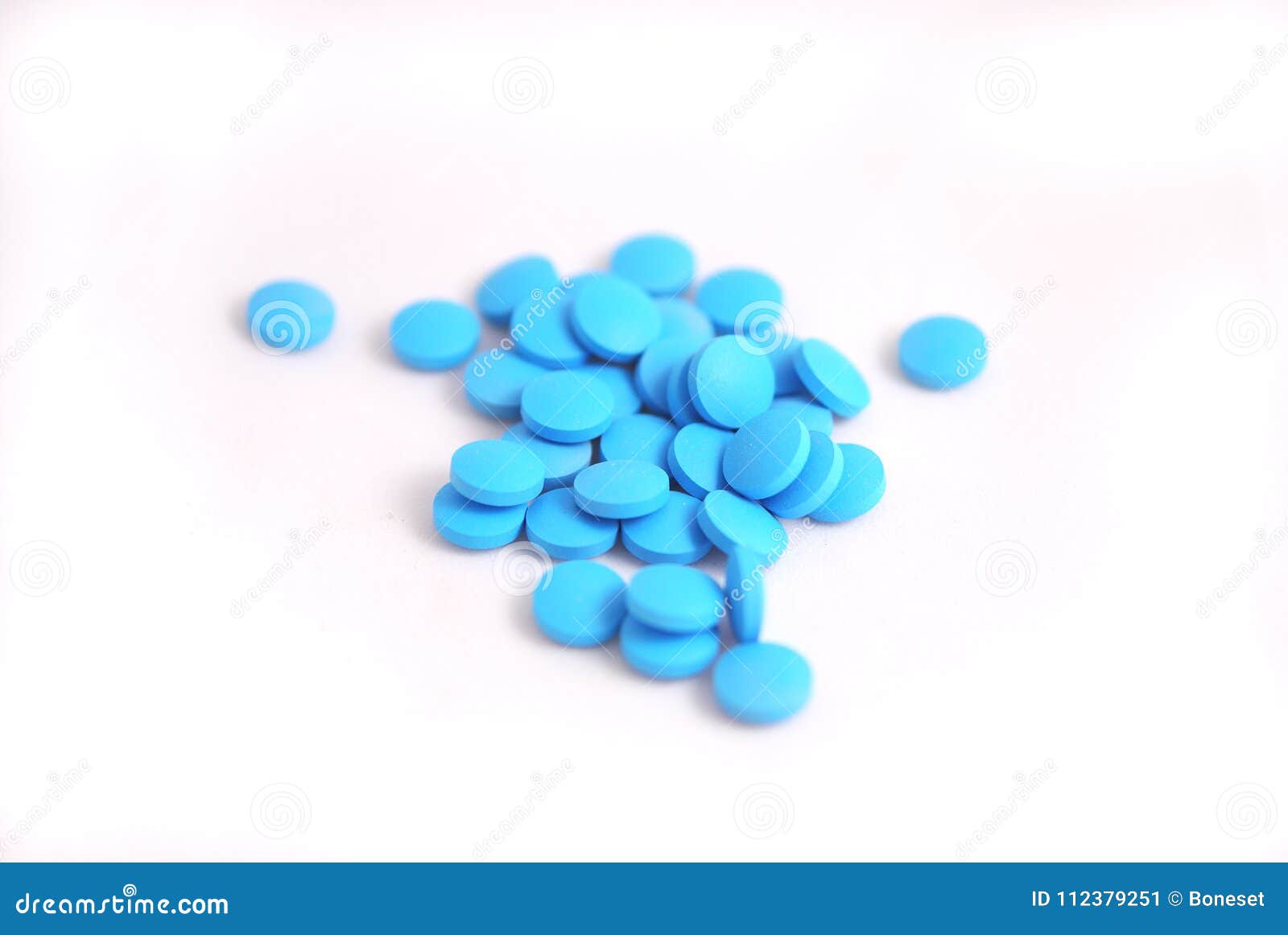 Bright blue round tablets stock image. Image of dark - 112379251