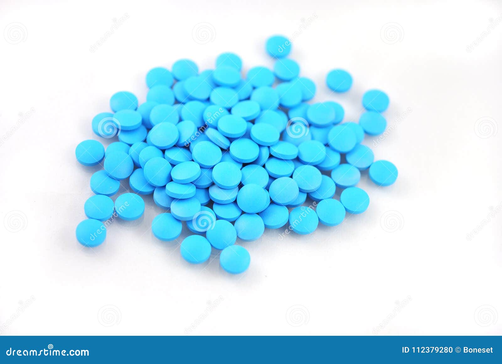 Bright blue round tablets stock photo. Image of medical - 112379280