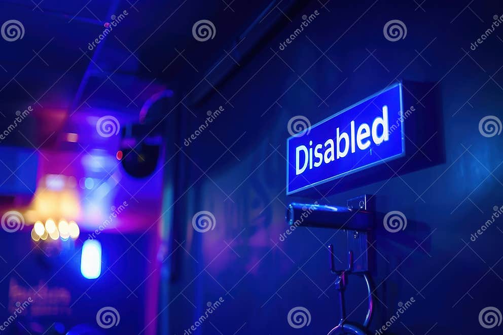 Sign Indicating Accessible Entry for Disabled Individuals in a Dimly ...