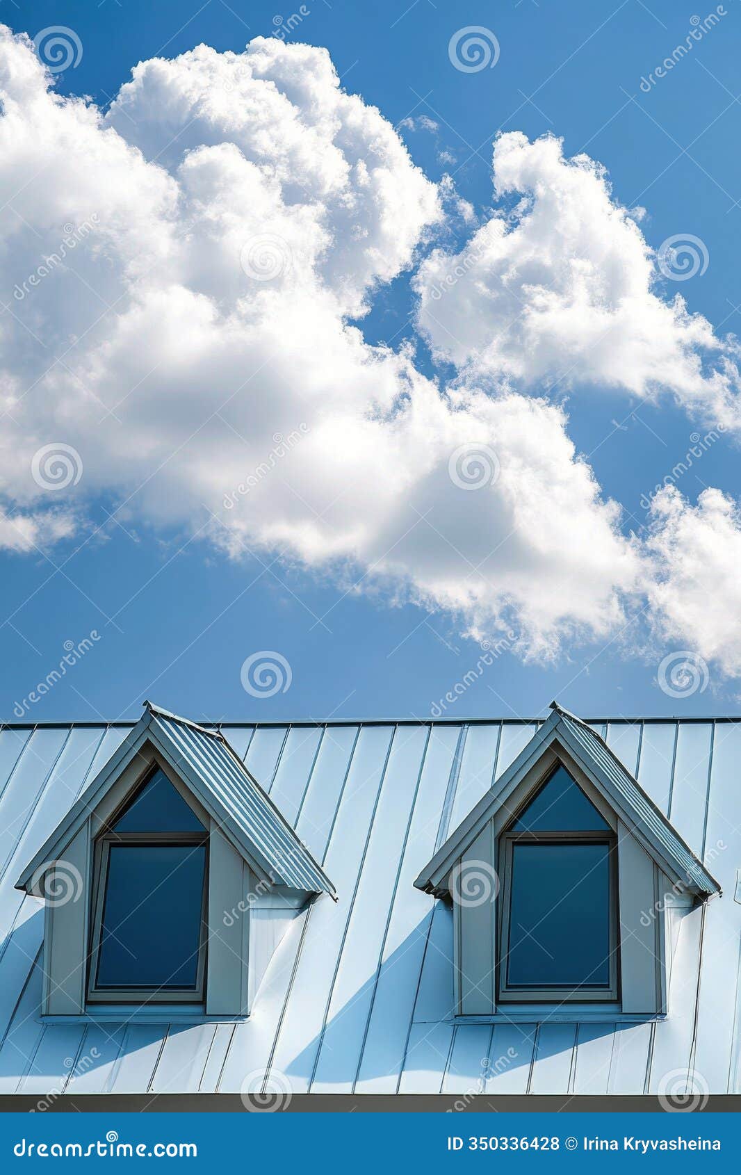 Bright Blue Sky with Clouds Above a Stylish Rooftop with Gable Windows ...
