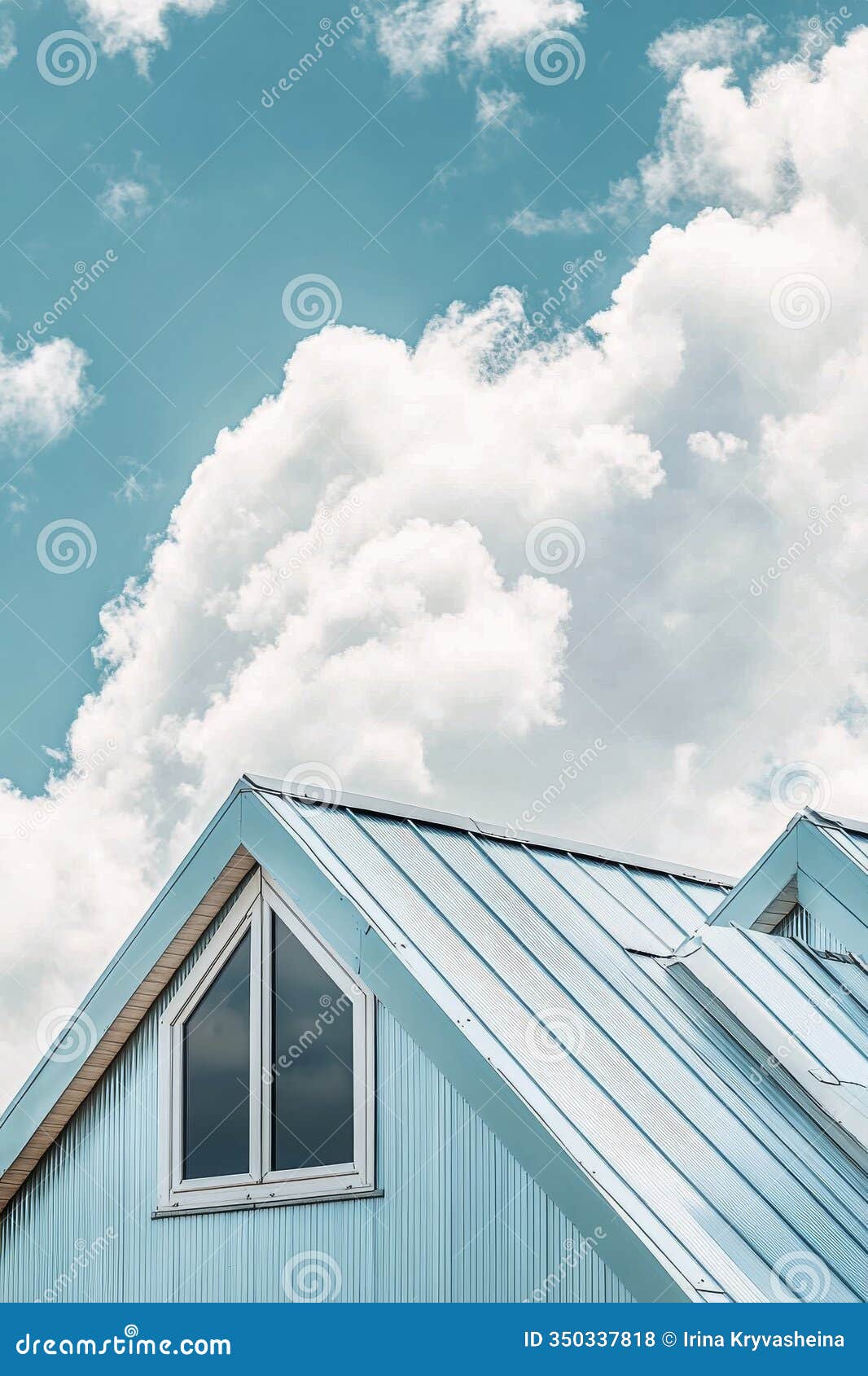 Bright Blue Sky with Clouds Above a Stylish Rooftop with Gable Windows ...