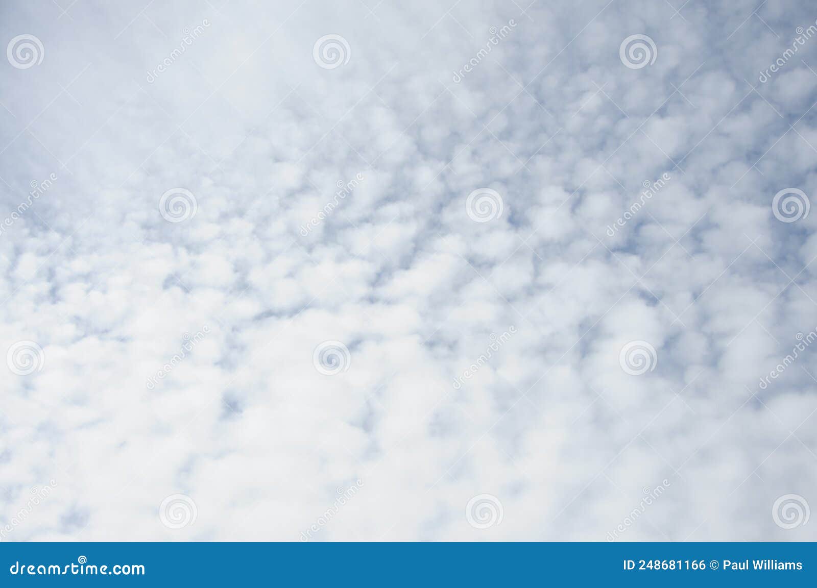 Bright Blue Sky with a Scattering of White Fluffy Clouds. Stock Photo ...