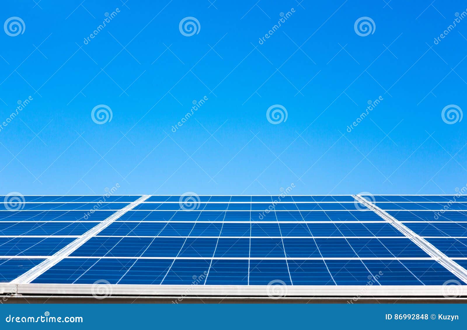 Bright Blue Solar Panels on Blue Clear Sky Background Stock Photo ...