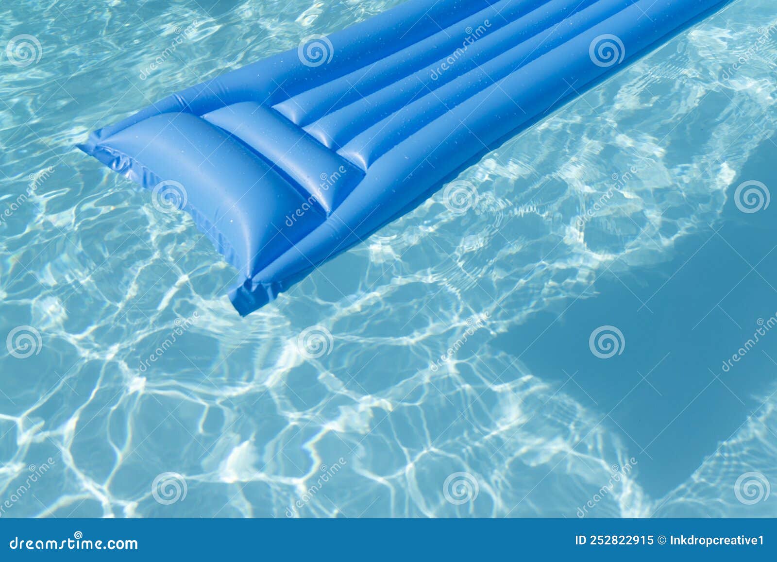 Bright Blue Summer Pool Lounger Float On A Rippled Swimming Pool ...