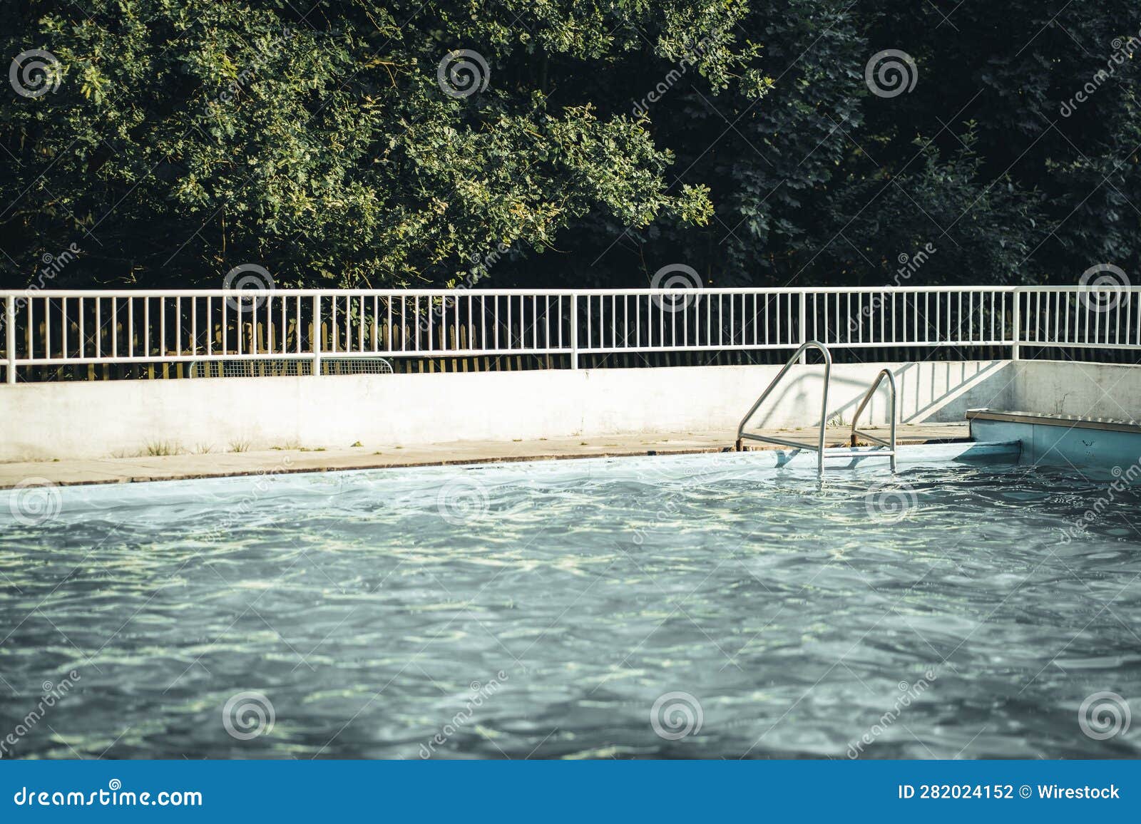 Bright Blue Swimming Pool on a Sunny Day Stock Photo - Image of inlet ...