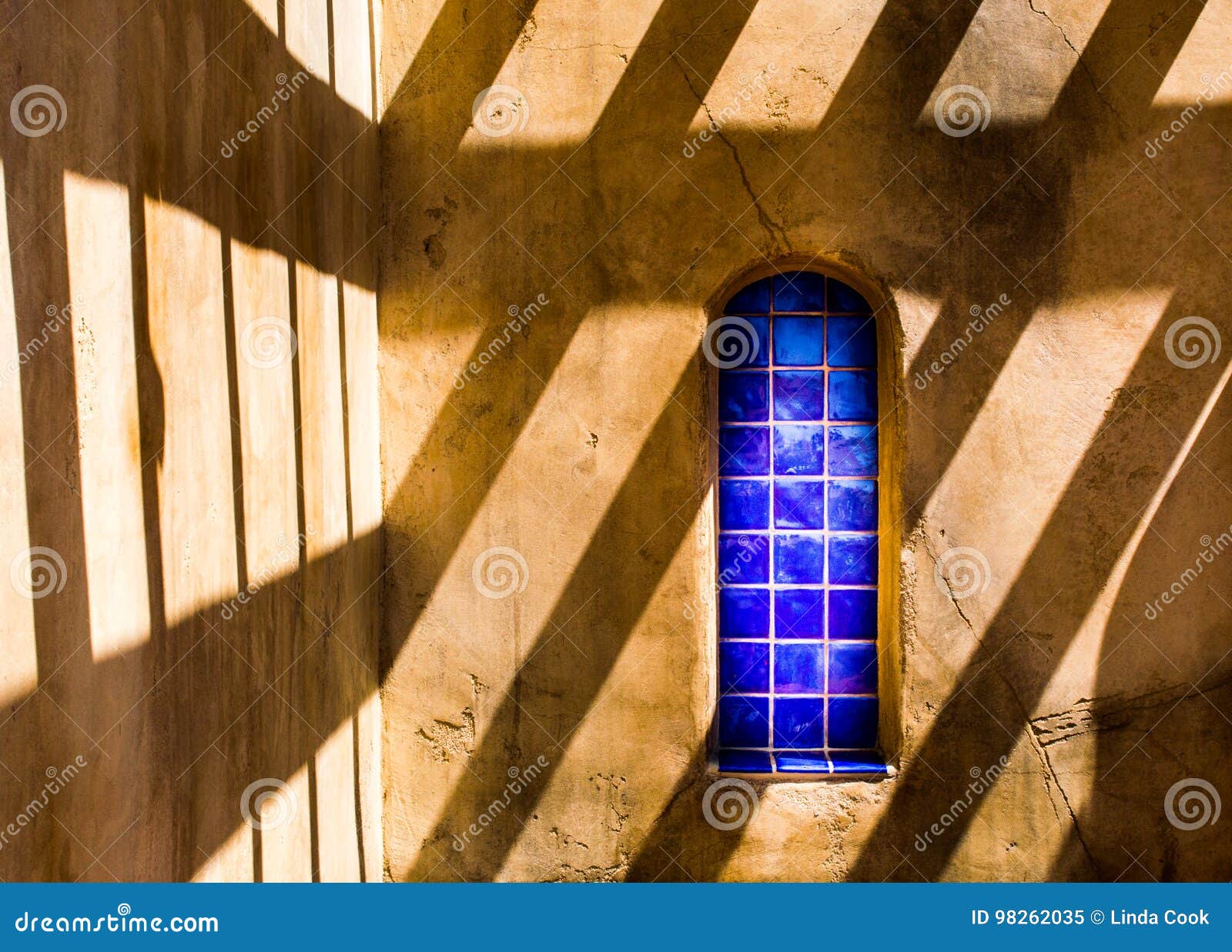 Bright Blue Tile Window on Adobe Building with Shadow Pattern Stock ...