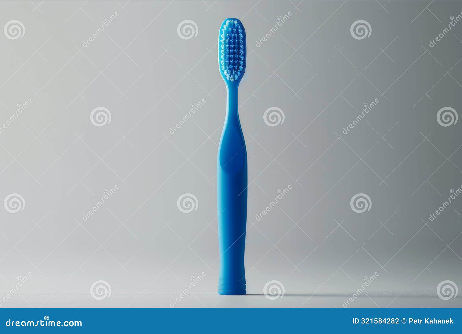A Bright Blue Toothbrush with Soft Bristles Standing Upright Against a ...