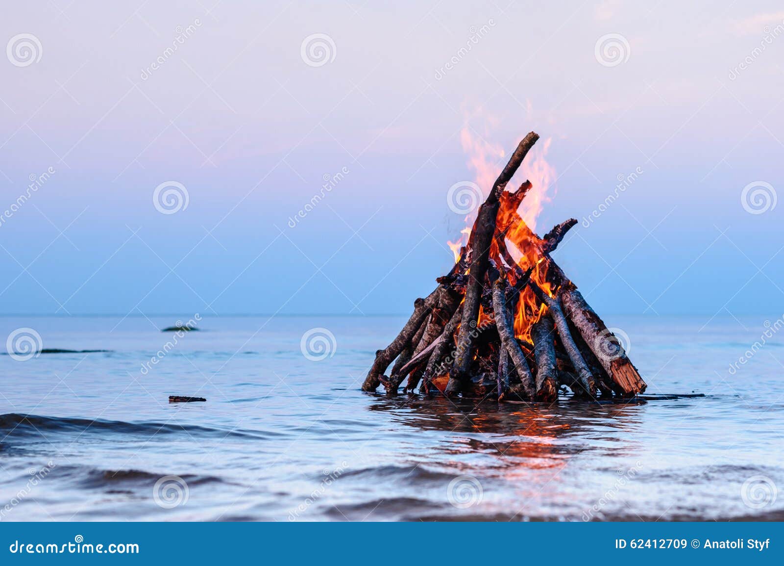 Bright campfire at sunset stock image. Image of horizon - 62412709