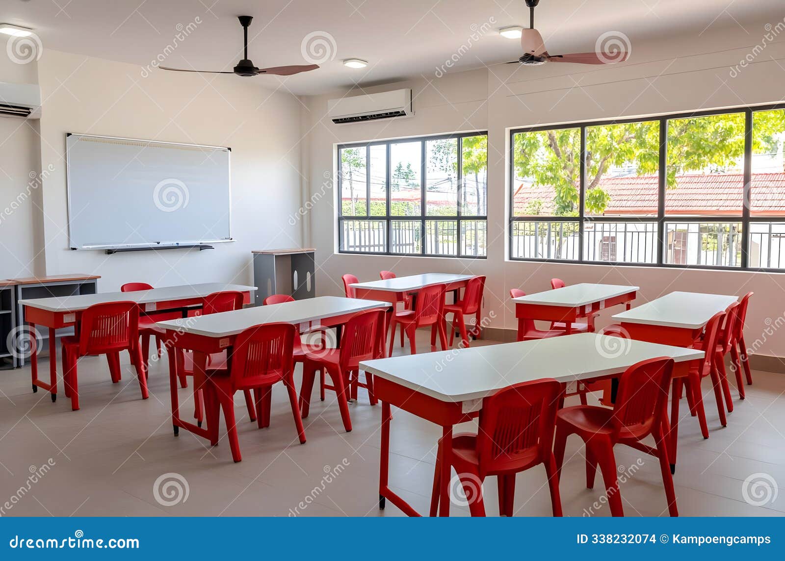 A Bright Classroom with Red Chairs and Tables, Designed for Learning ...