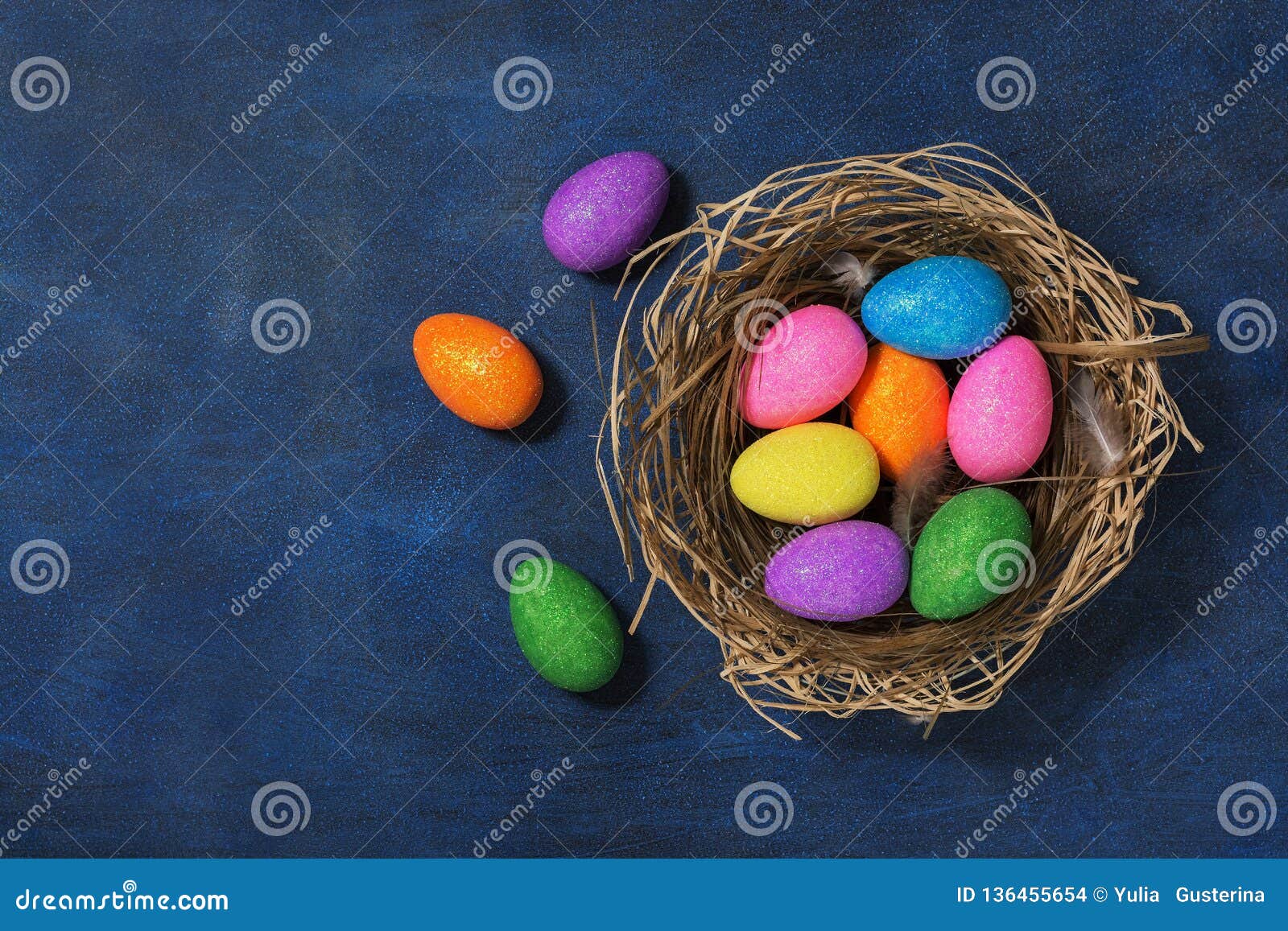 Bright Colored Easter Eggs in a Nest on a Blue Background. Top View ...