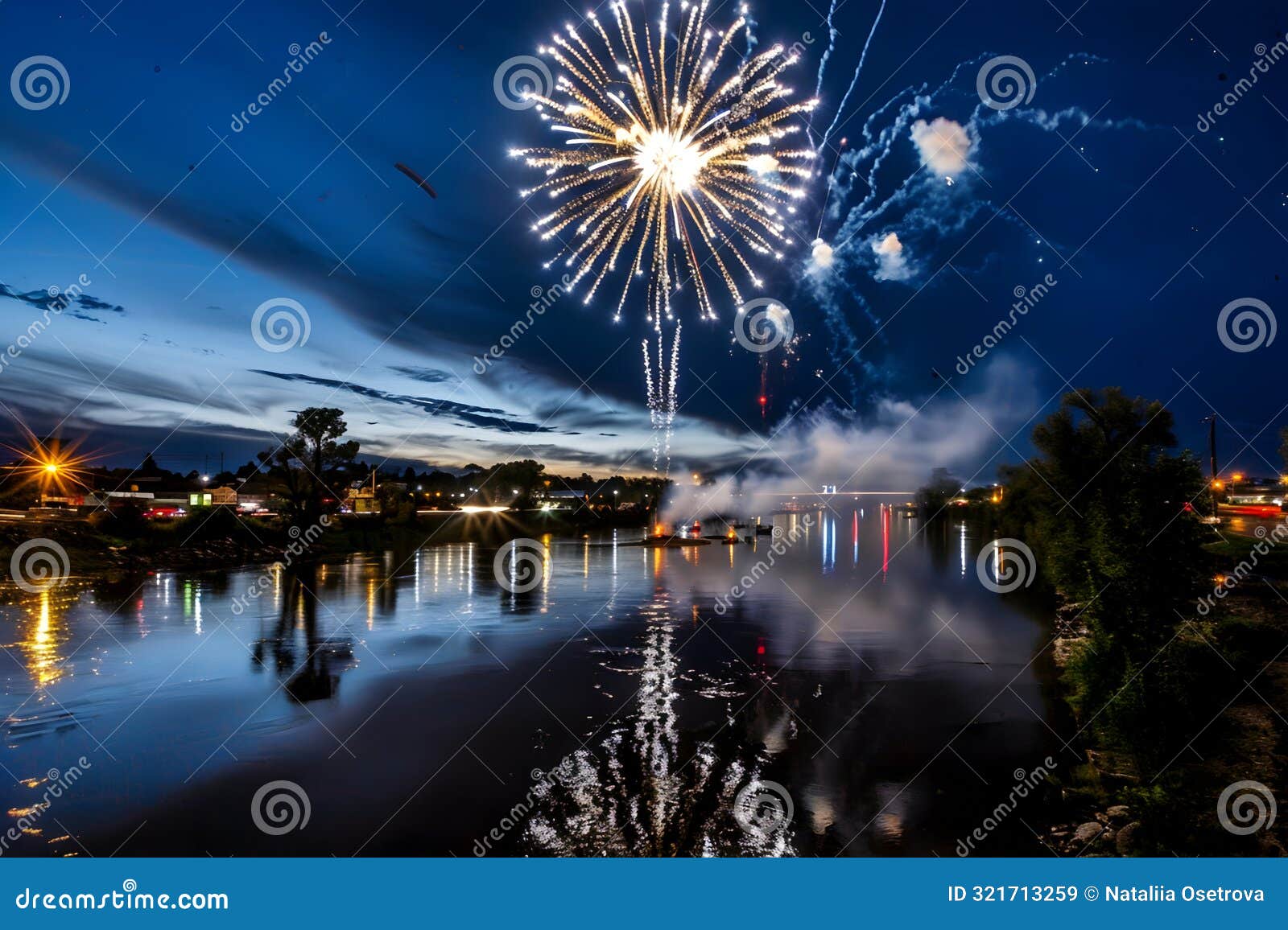 Bright Fireworks Exploding in the Night Sky Over the River, Reflecting ...
