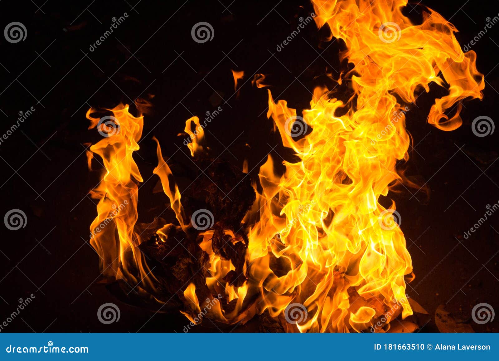 Bright Flames of Fire on a Dark Background Close Up Stock Photo - Image ...