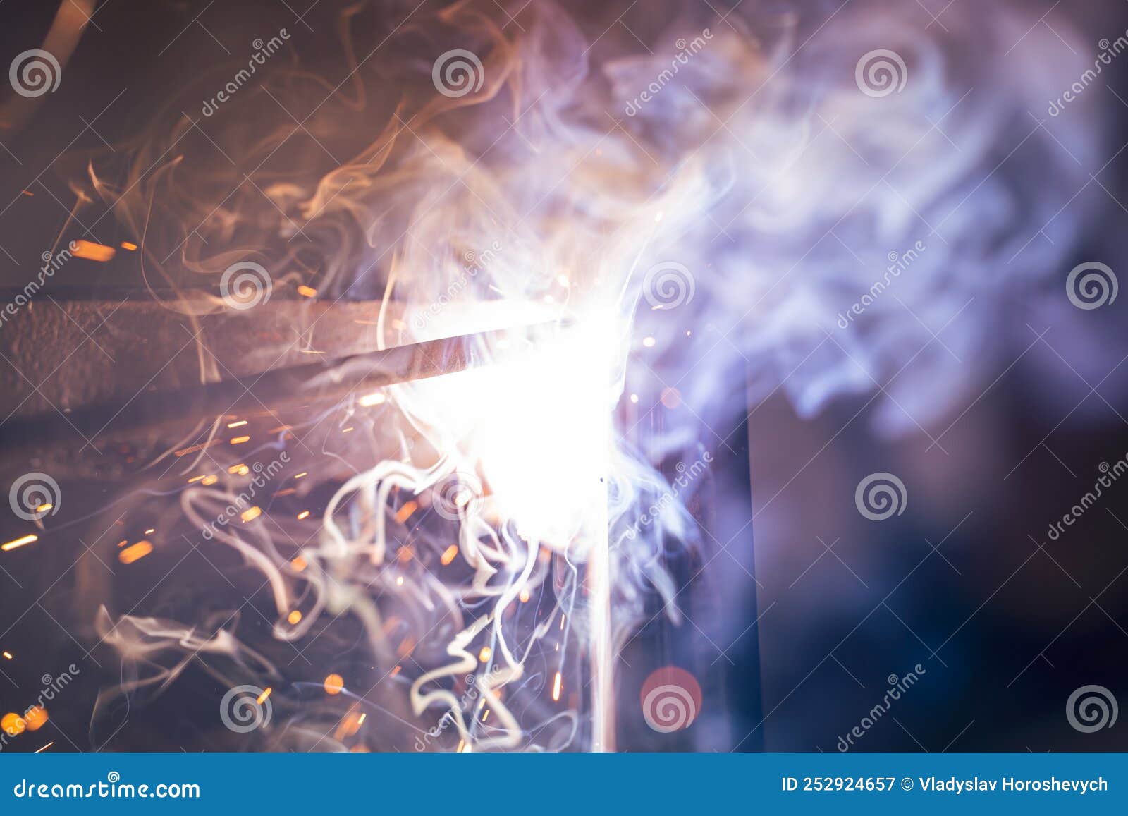 A Bright Flash of an Electric Arc between the Electrode and the Metal ...