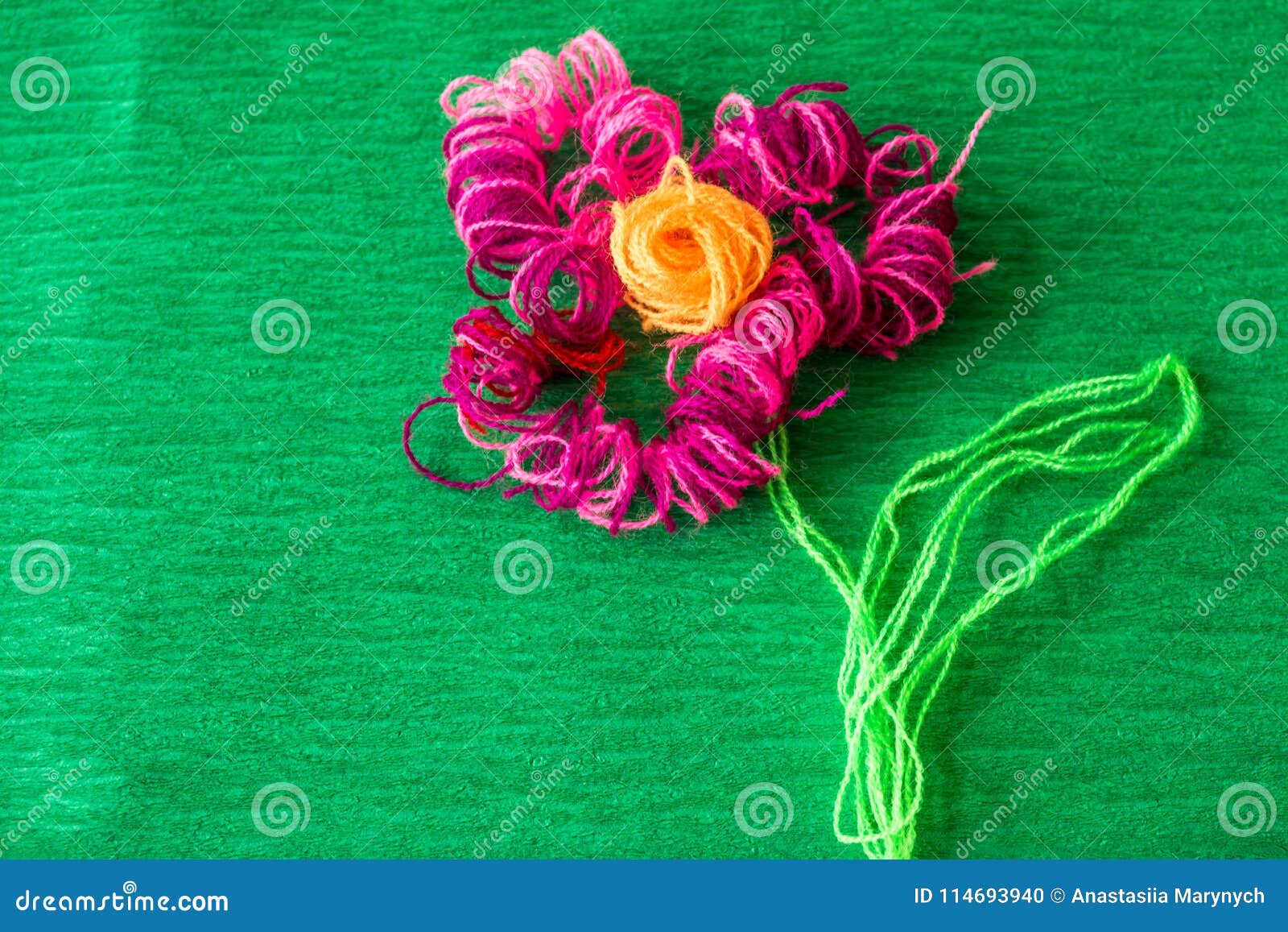 Bright Flower Made of Threads on Green Background Stock Photo - Image ...