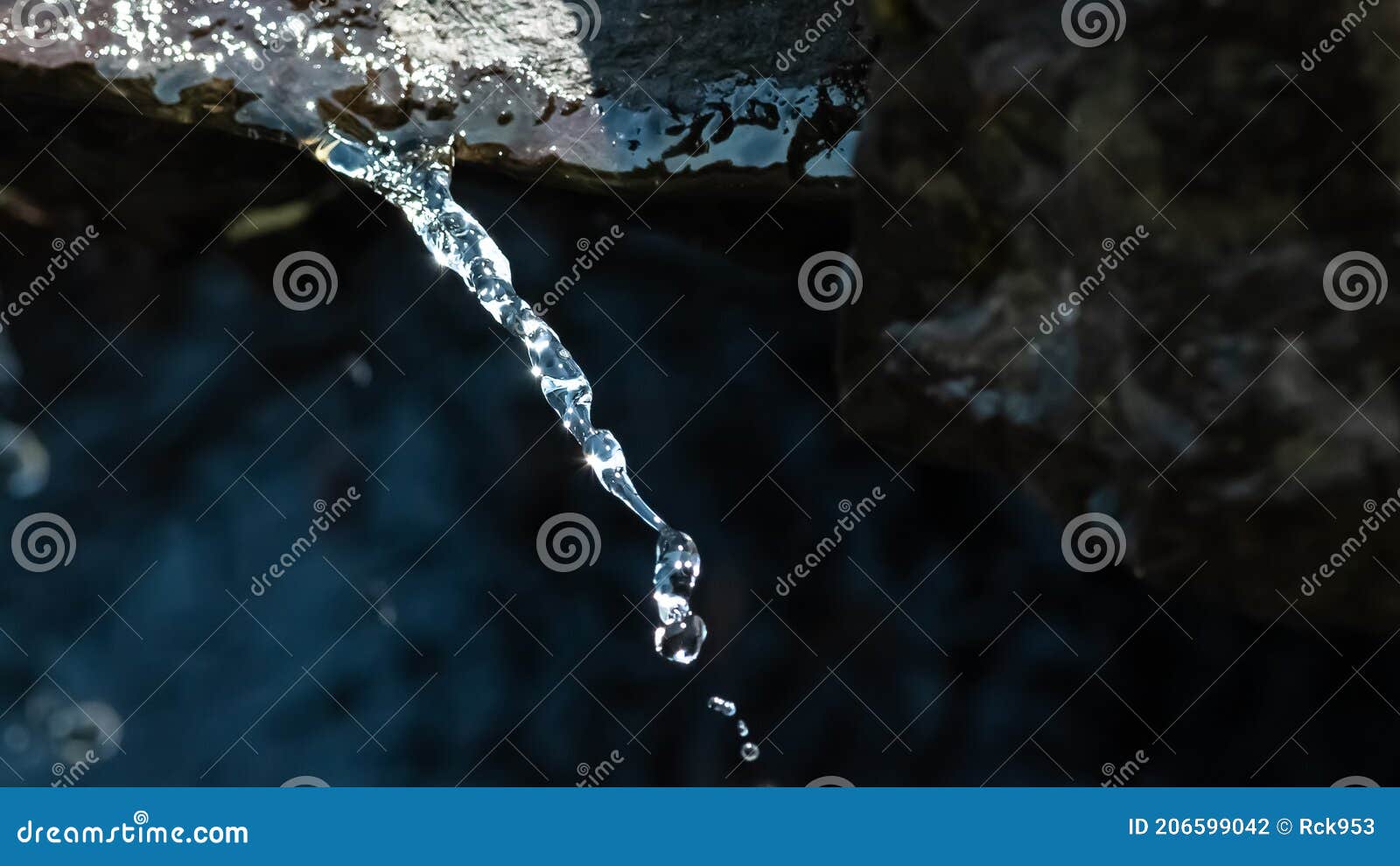 Bright Glint of Sunlight Reflecting from a Thin Stream of Water Stock ...