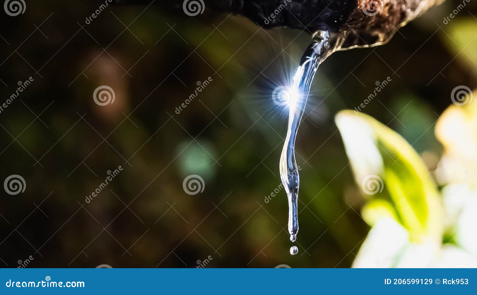 Bright Glint of Sunlight Reflecting from a Thin Stream of Water Stock ...