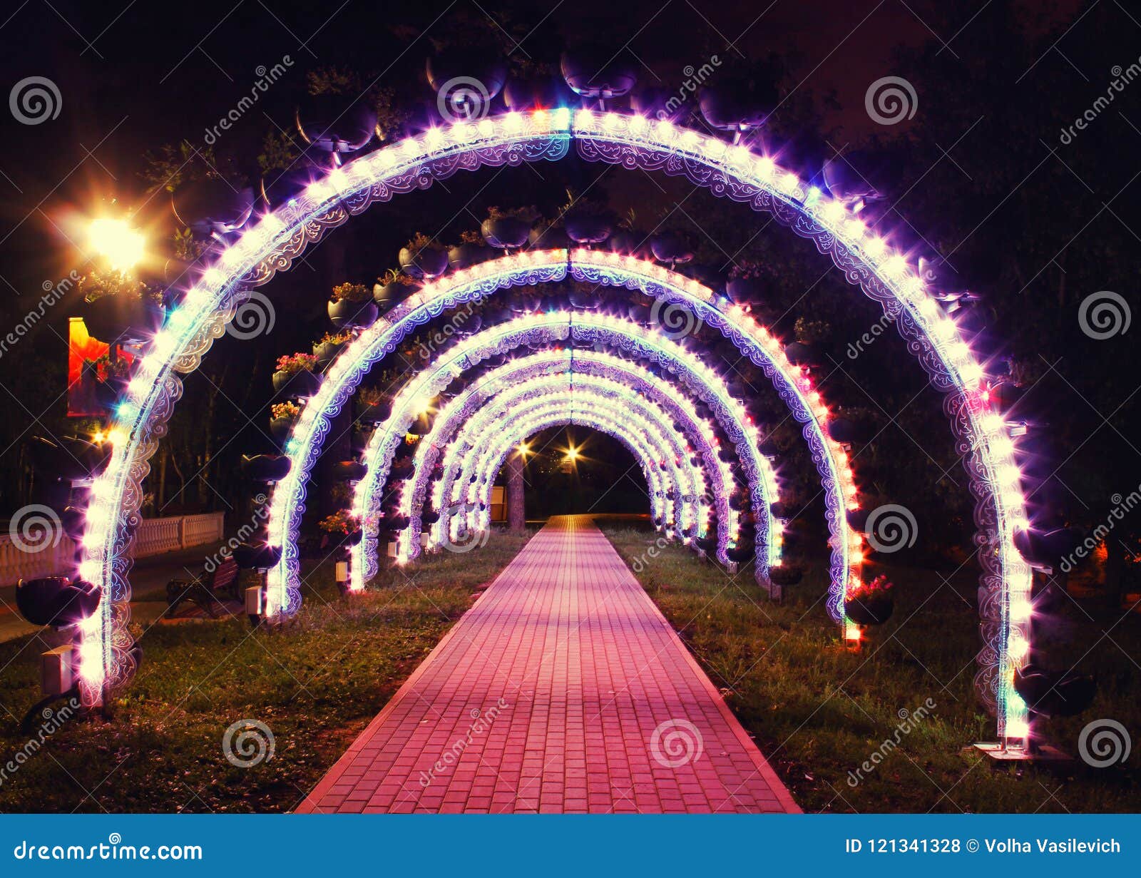 Bright Glowing Arch of Colored Lanterns in the Park in the Evening ...